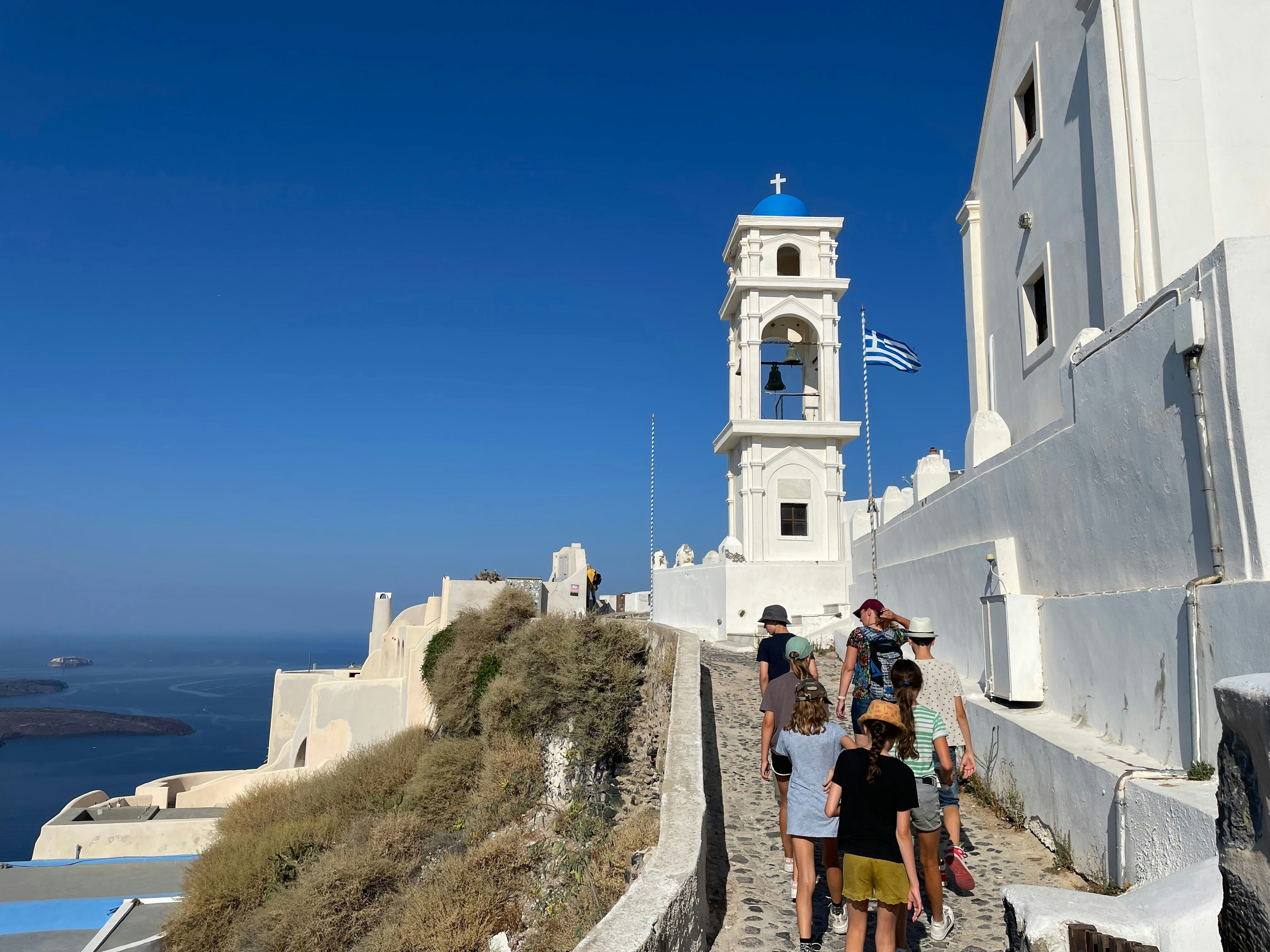 Whitewashed Gardens and Bell Tower on a Sea-Gazing Cliff
