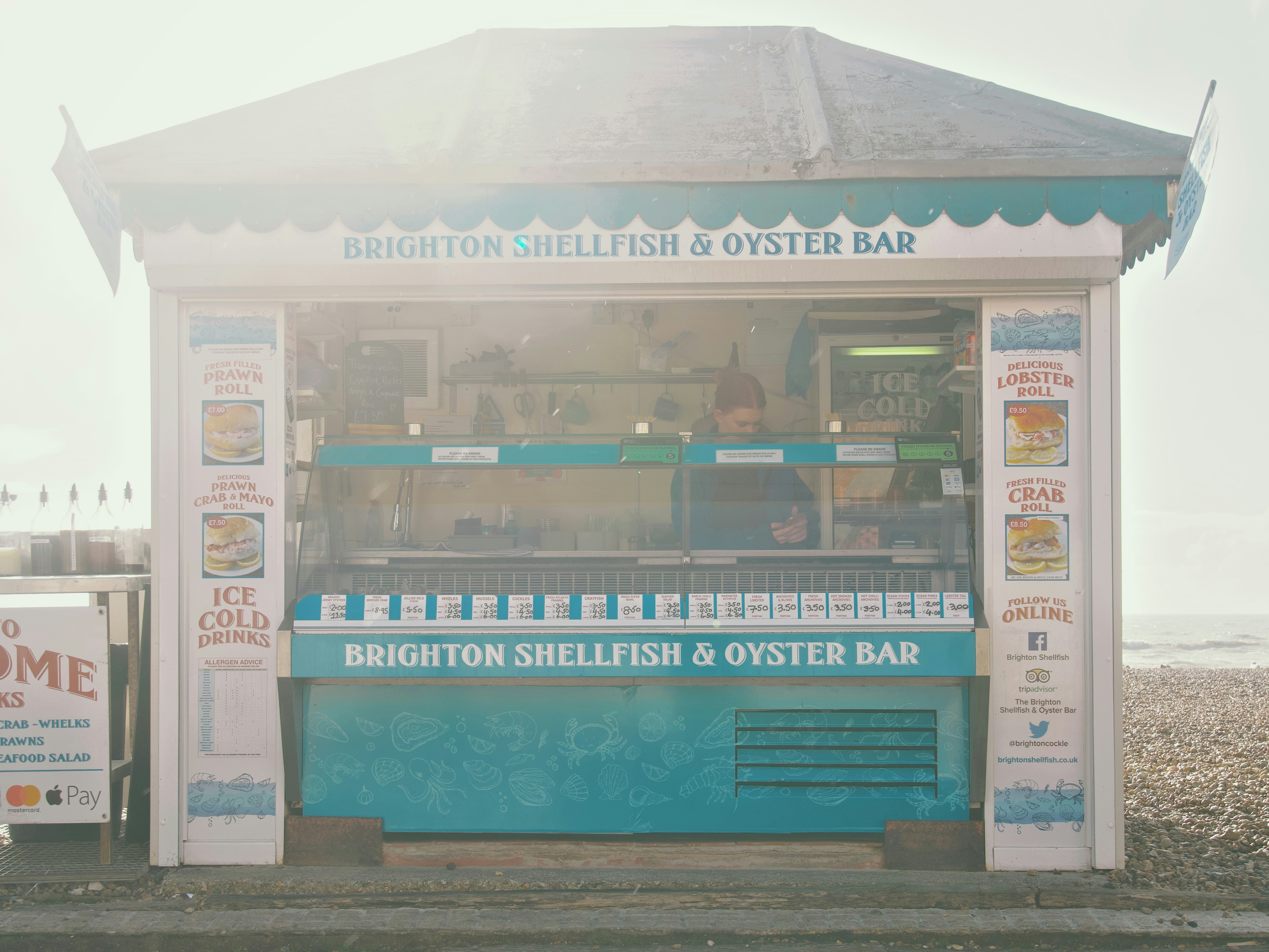 Brighton Oyster Bar Window: Coastal Snack Stand on the Beach