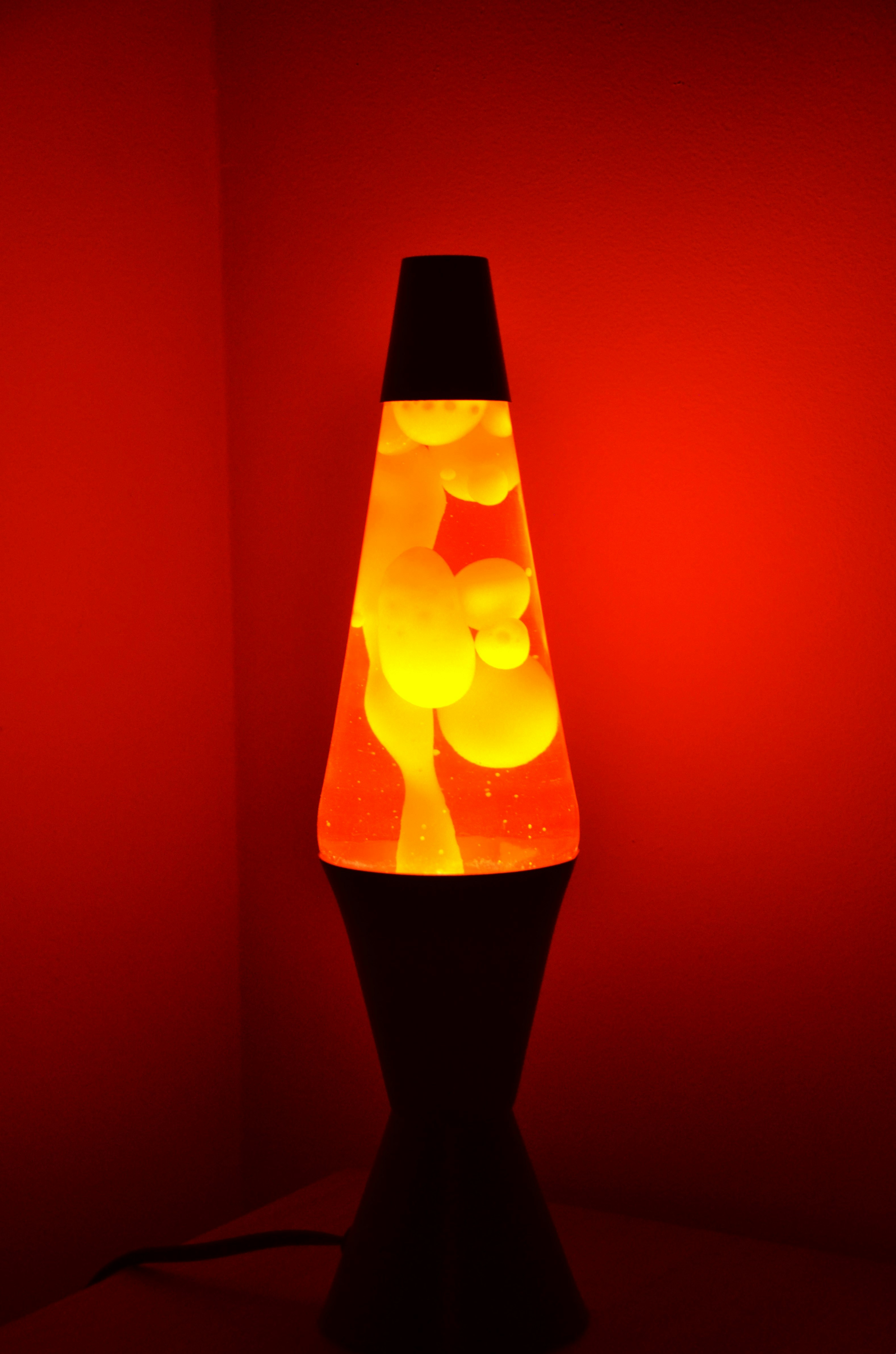 A lava lamp glows with orange and yellow blobs. photo – Free Relaxation ...