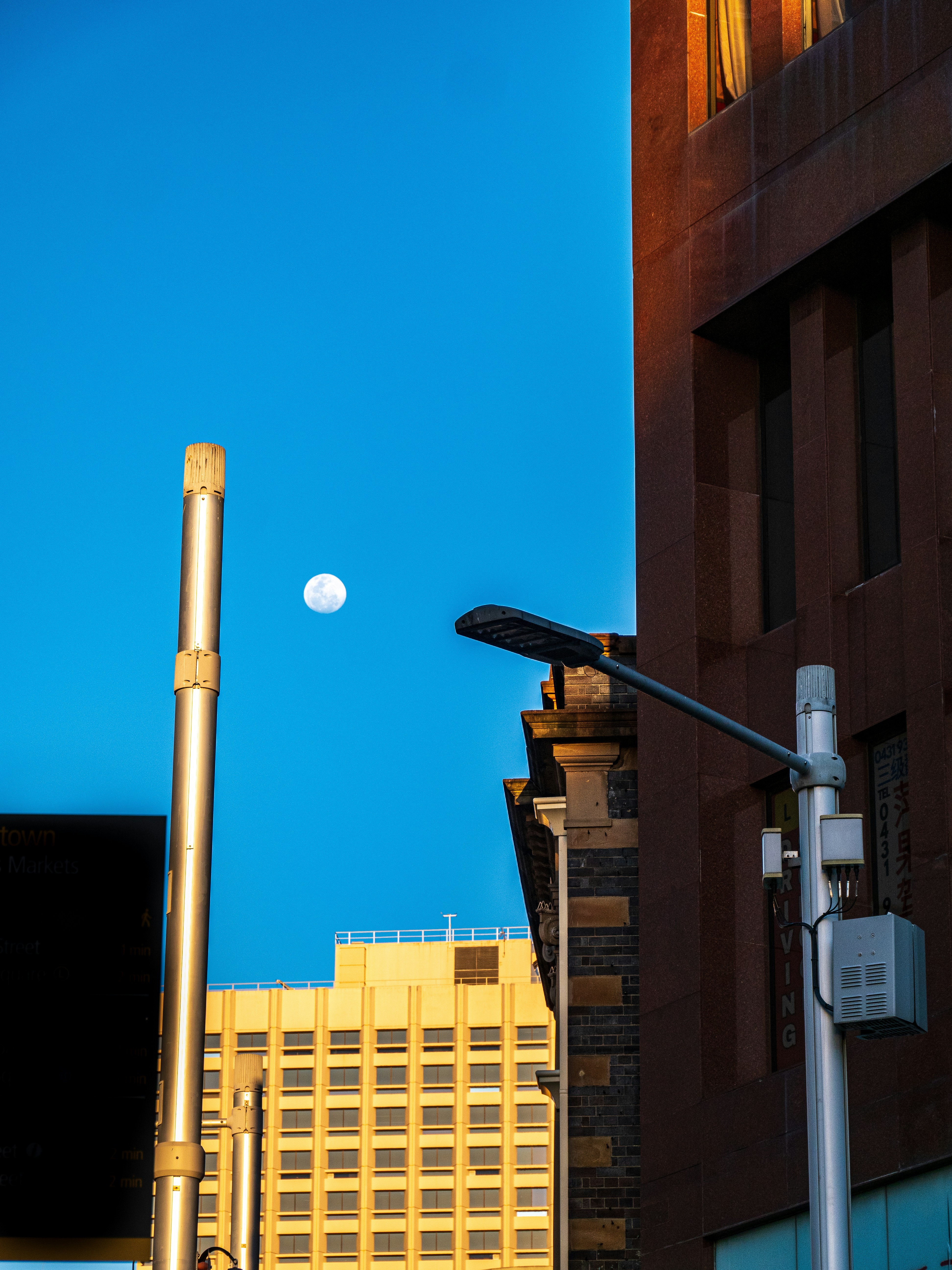 Moonrise over Neon Street: A Corner of Urban Geometry
