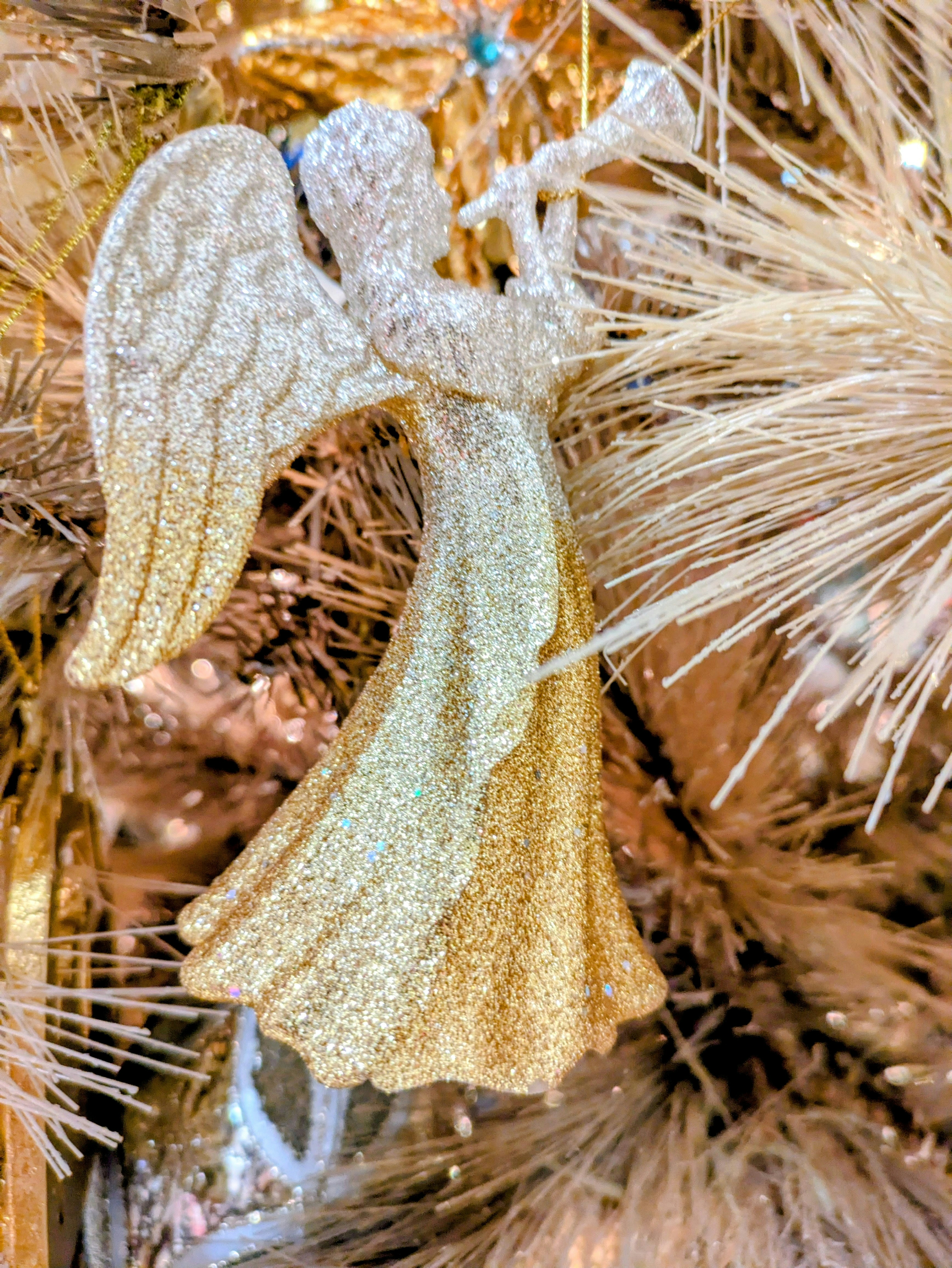 Gold and silver angel with horn ornament