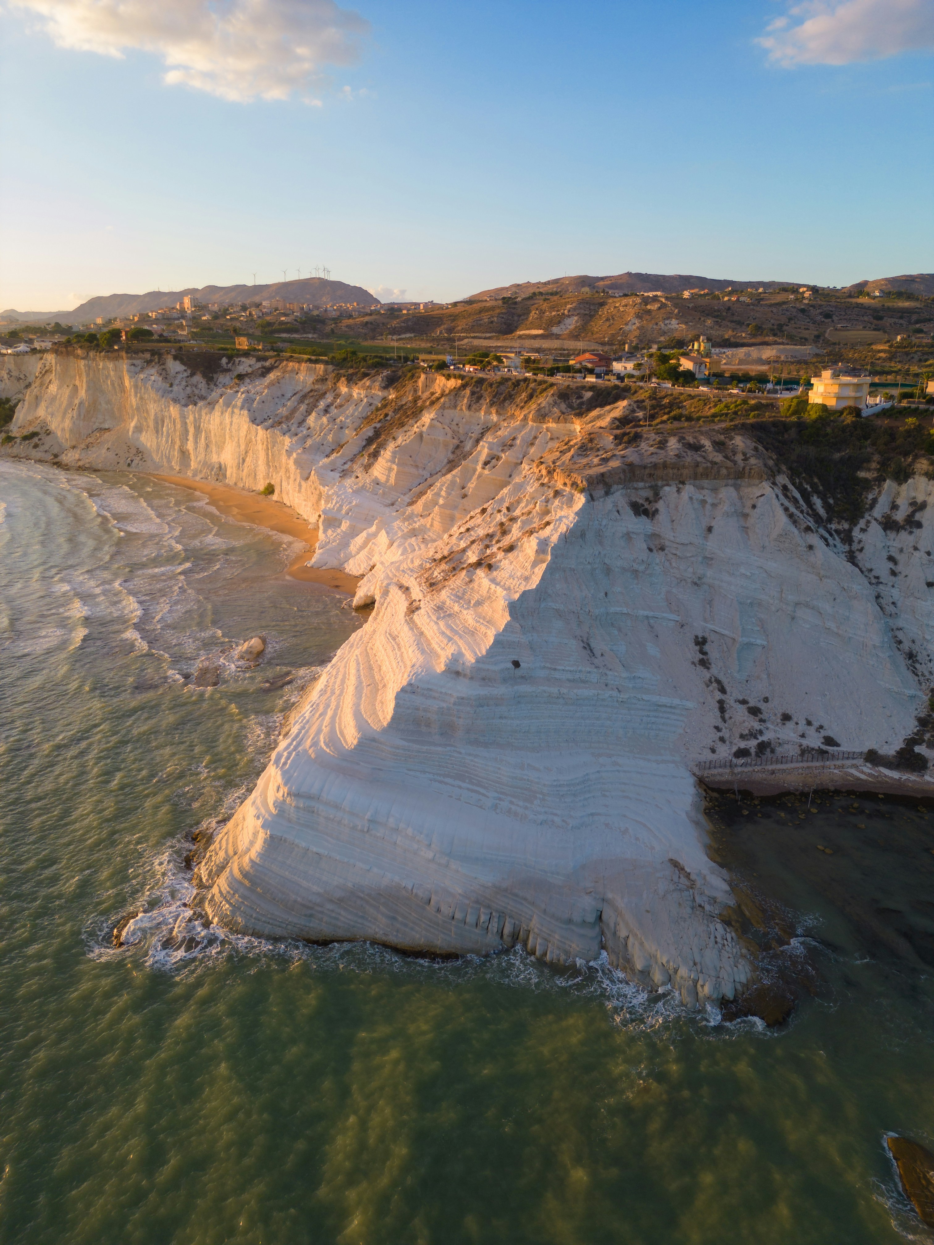White Chalk Cliffs Reaching Toward the Sea at Sunset