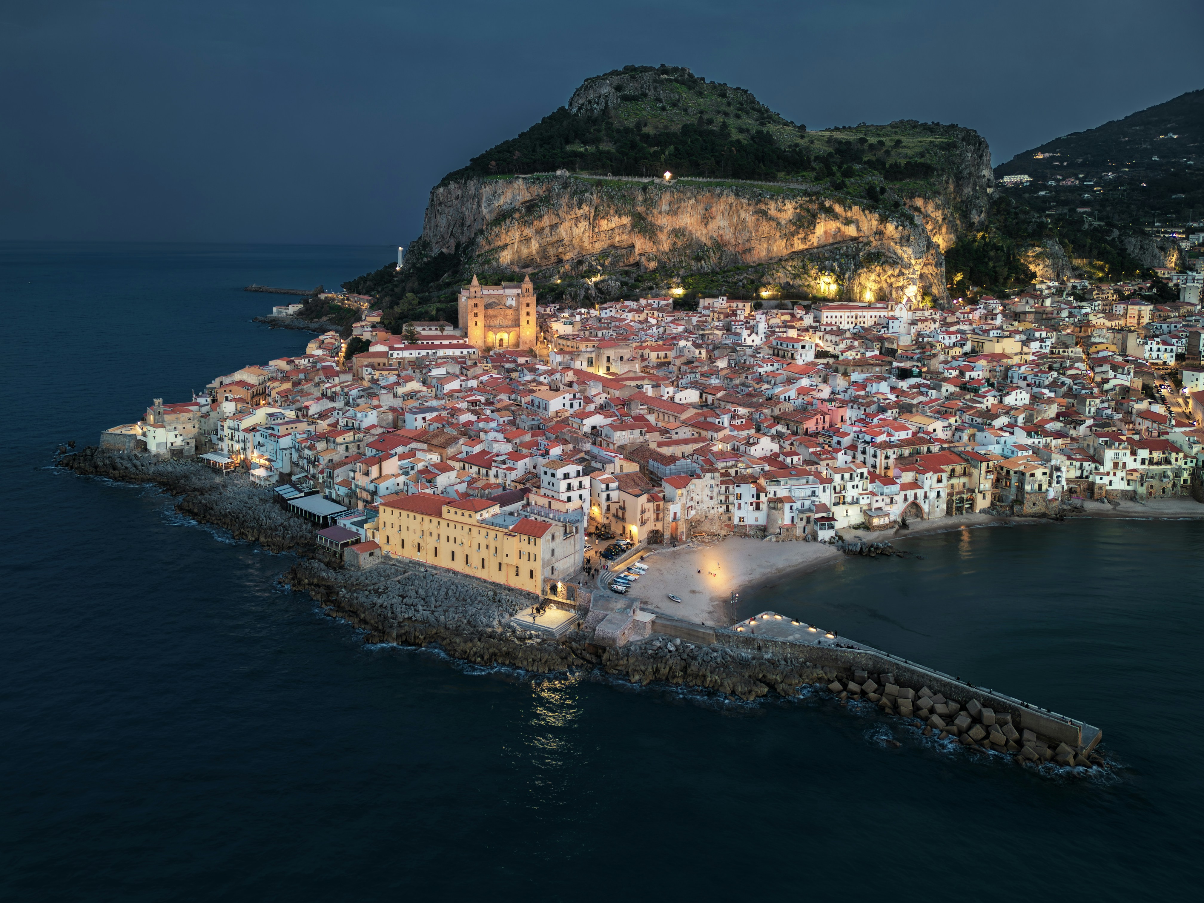 Lanterned Cliffs: A Coastal Town Quietly Beckons at Dusk