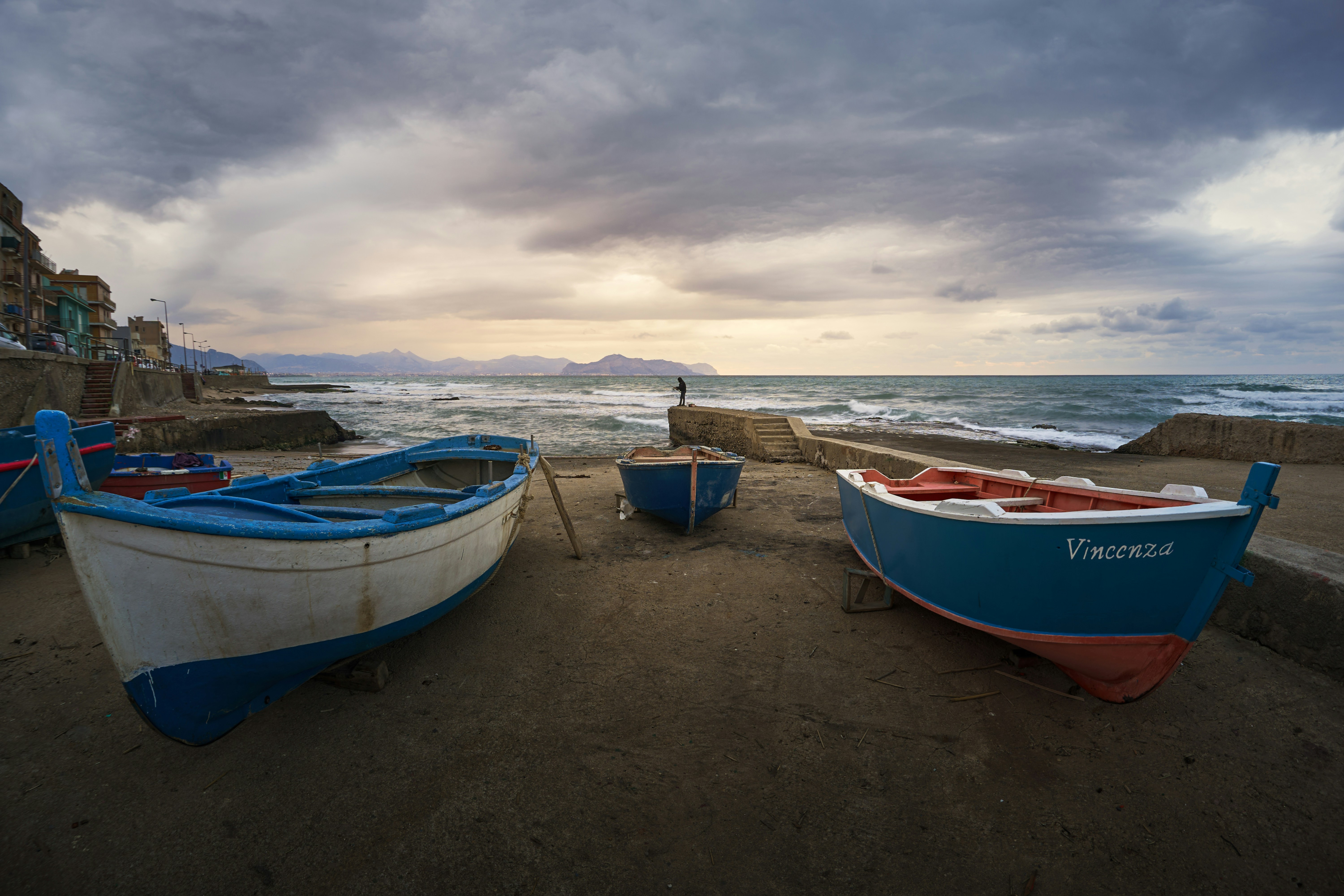Bleached Boats Resting Along a Quiet Sardinian Shore at Dusk
