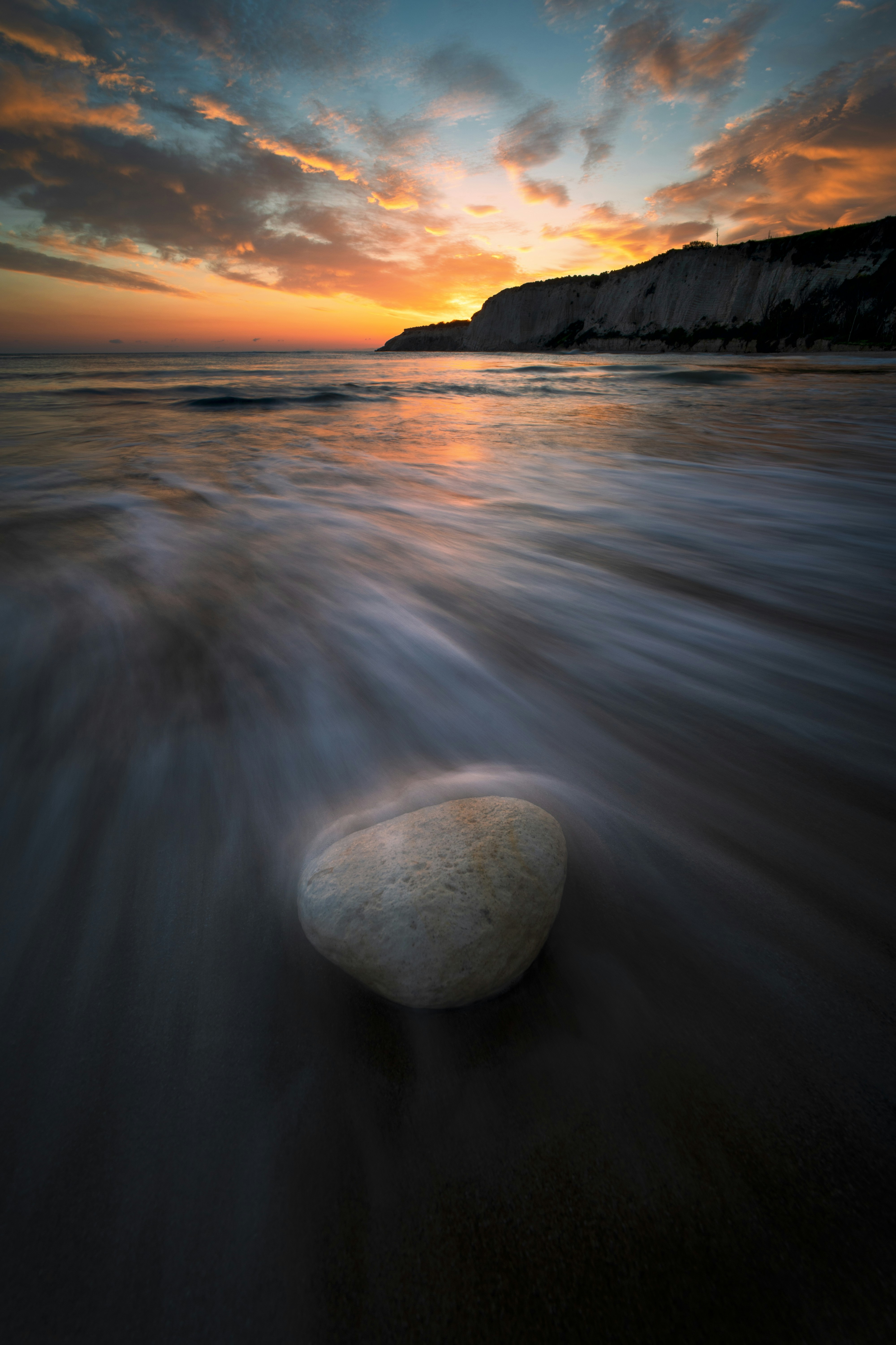 Sea-stone at Sundown: A Smooth Path of Tide and Light