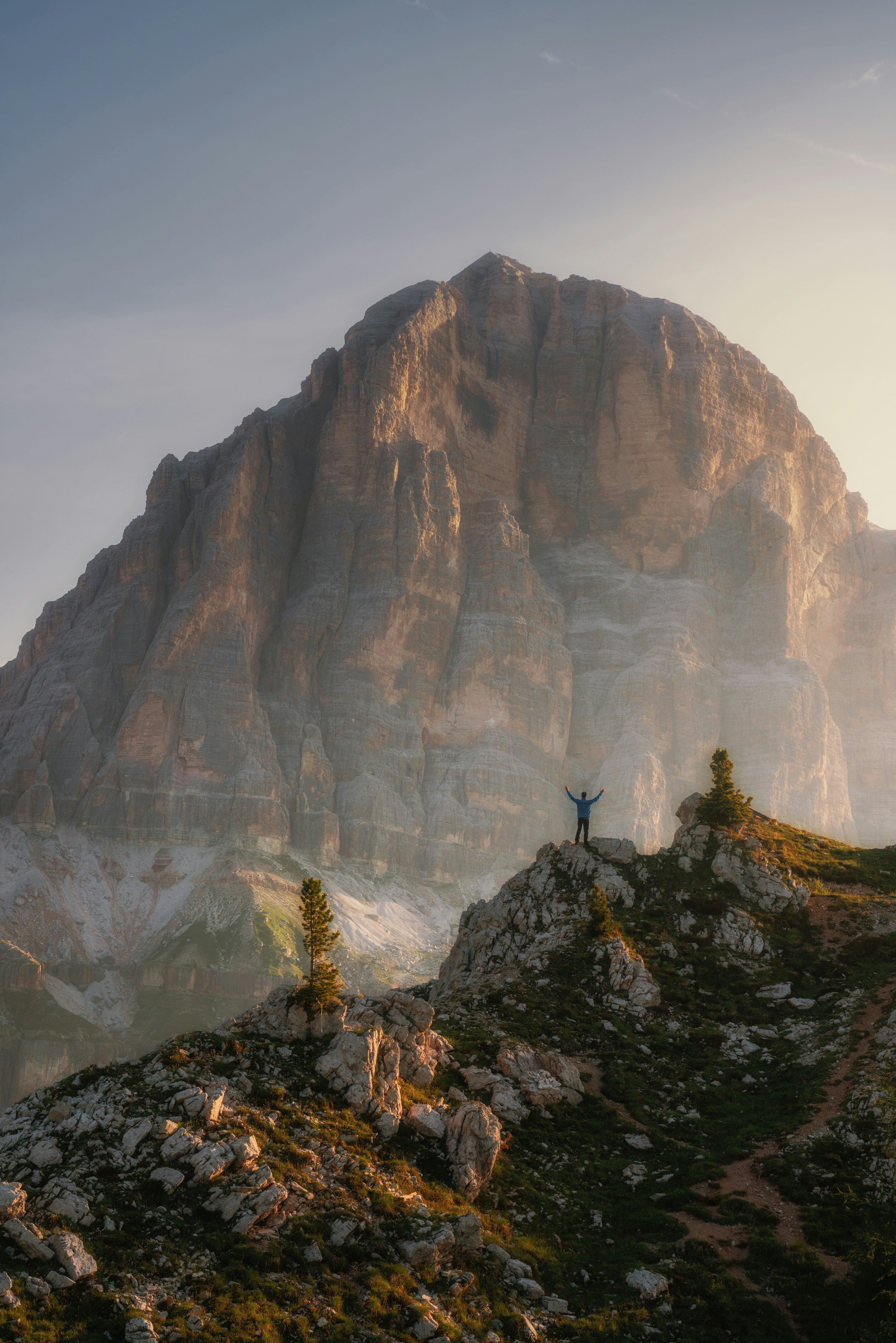 Ridge Summit: A Lone Figure Reaches for the Mountain Crown