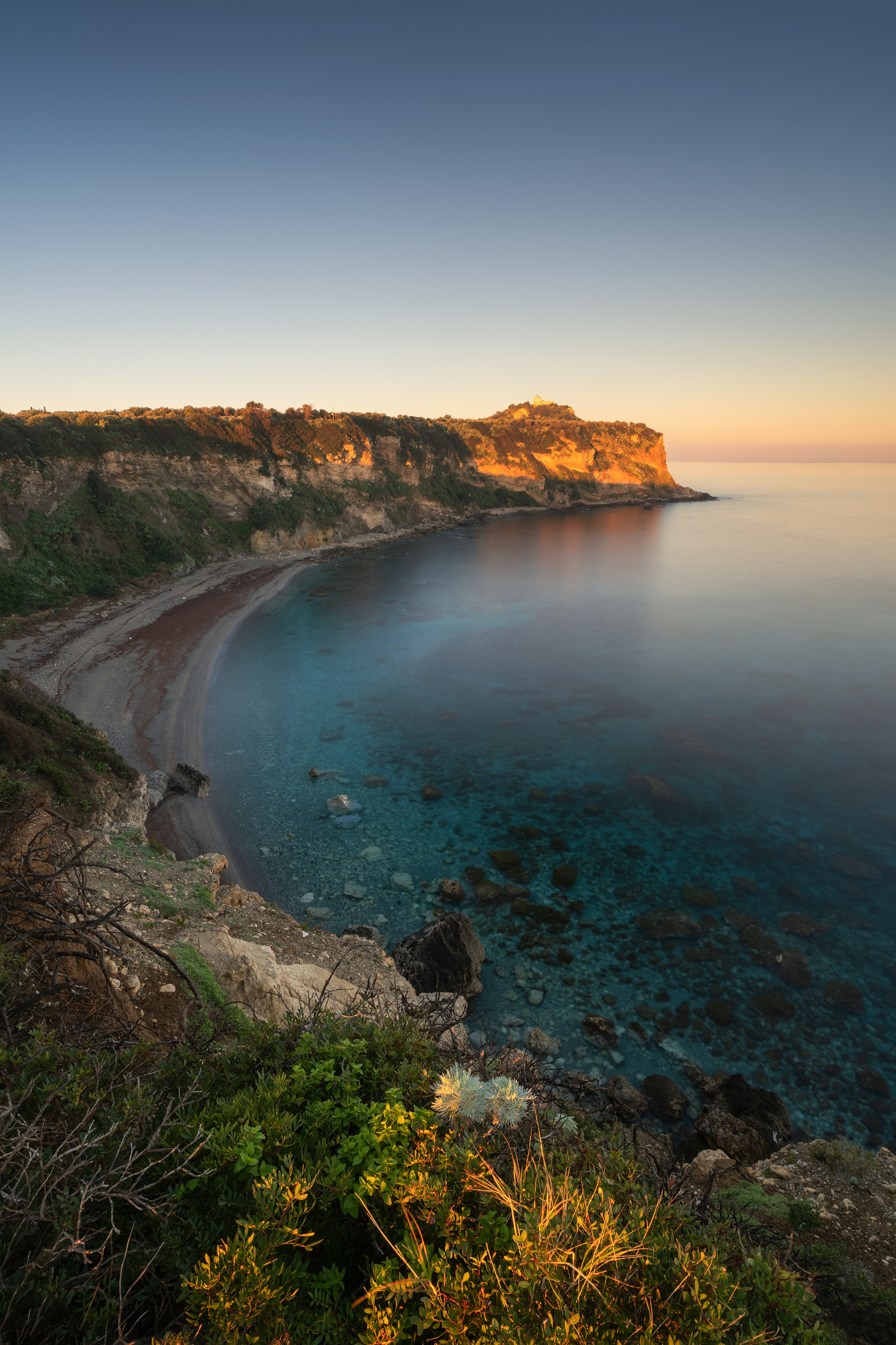 Golden Cliff Horizon Over Quiet Coastal Cove