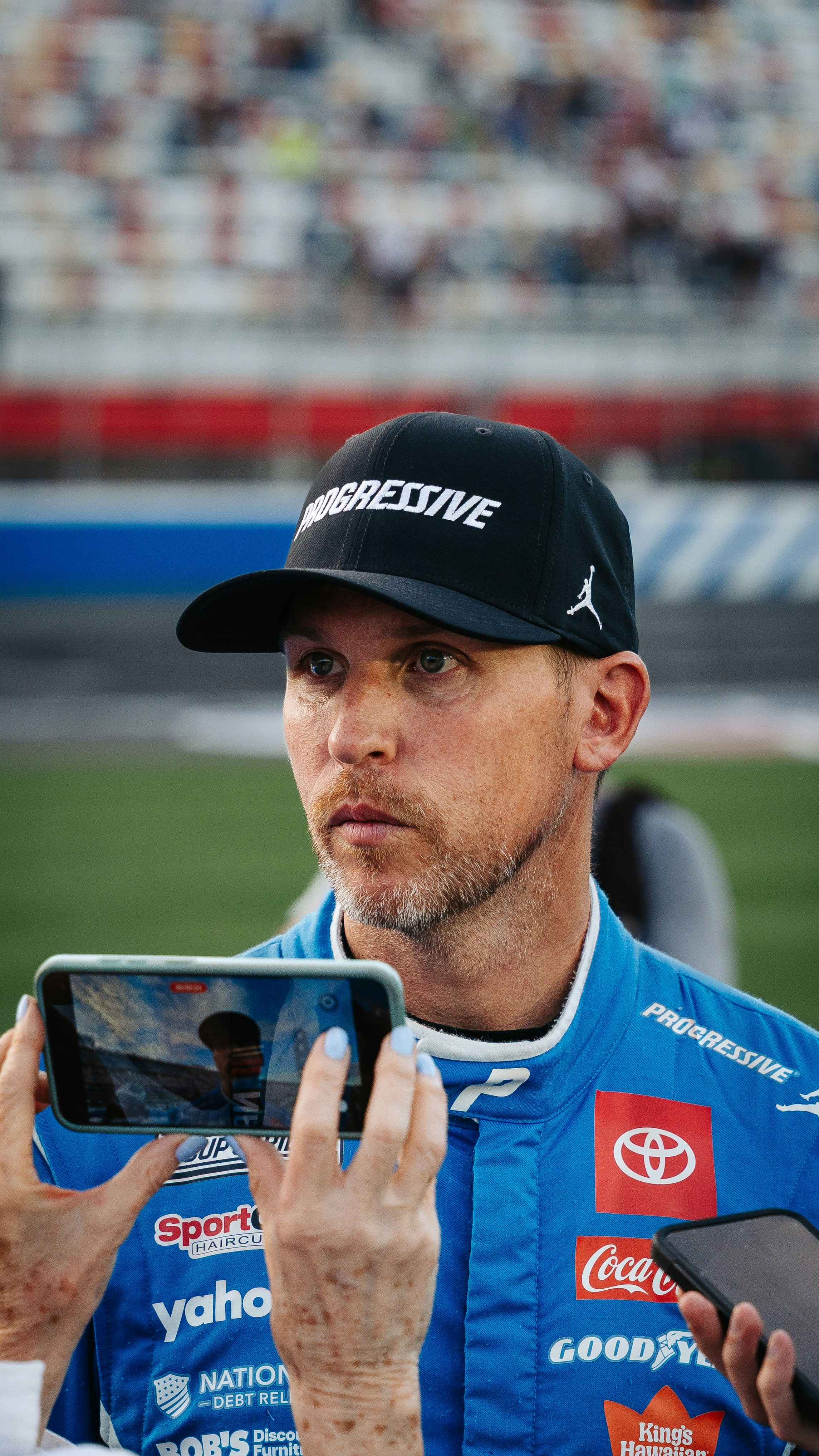 Cap & Go: Focused Face Amid Racing Dialogue