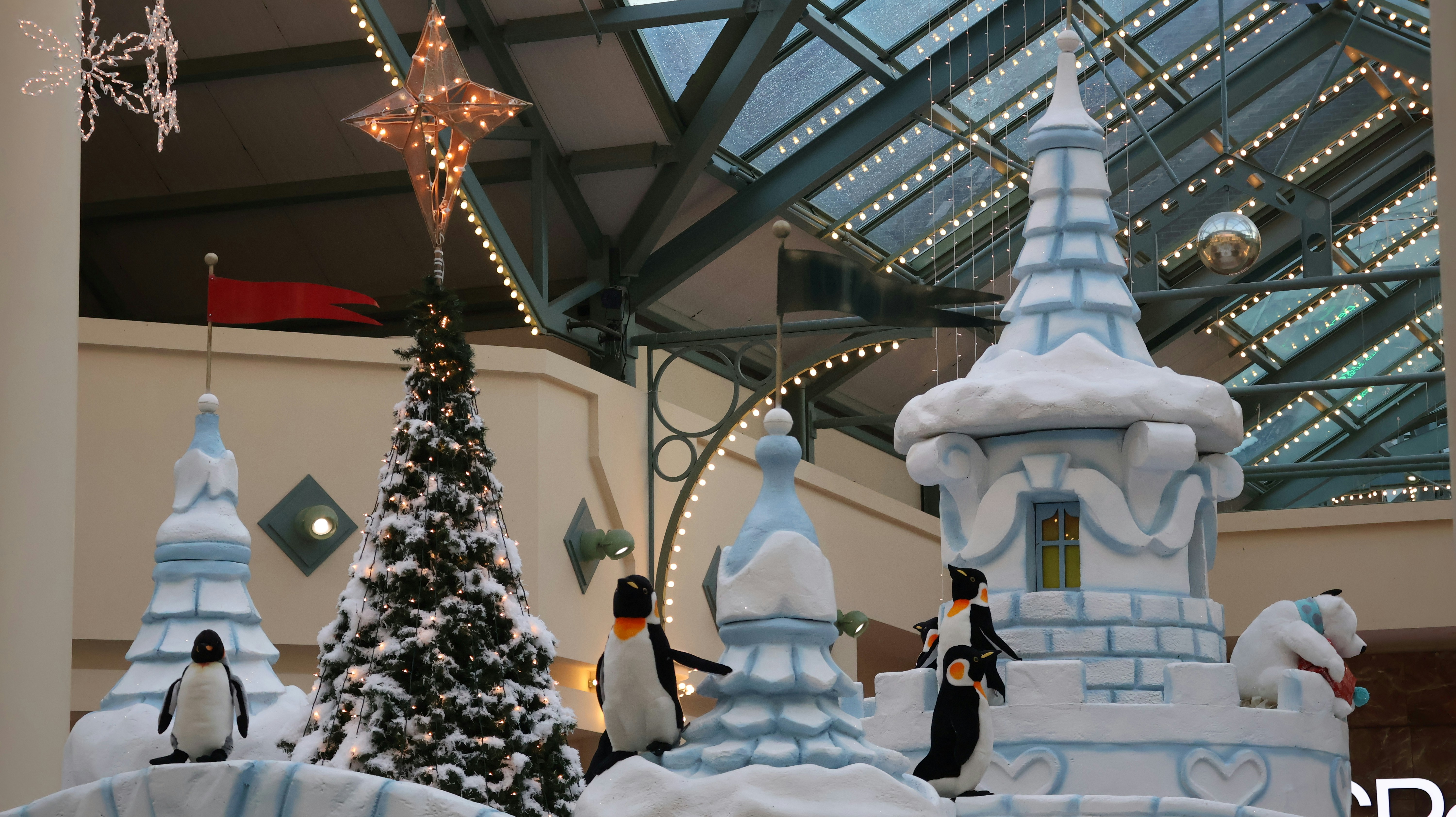 Penguin Parade under a Snow-Kissed Castle at the Winter Dome