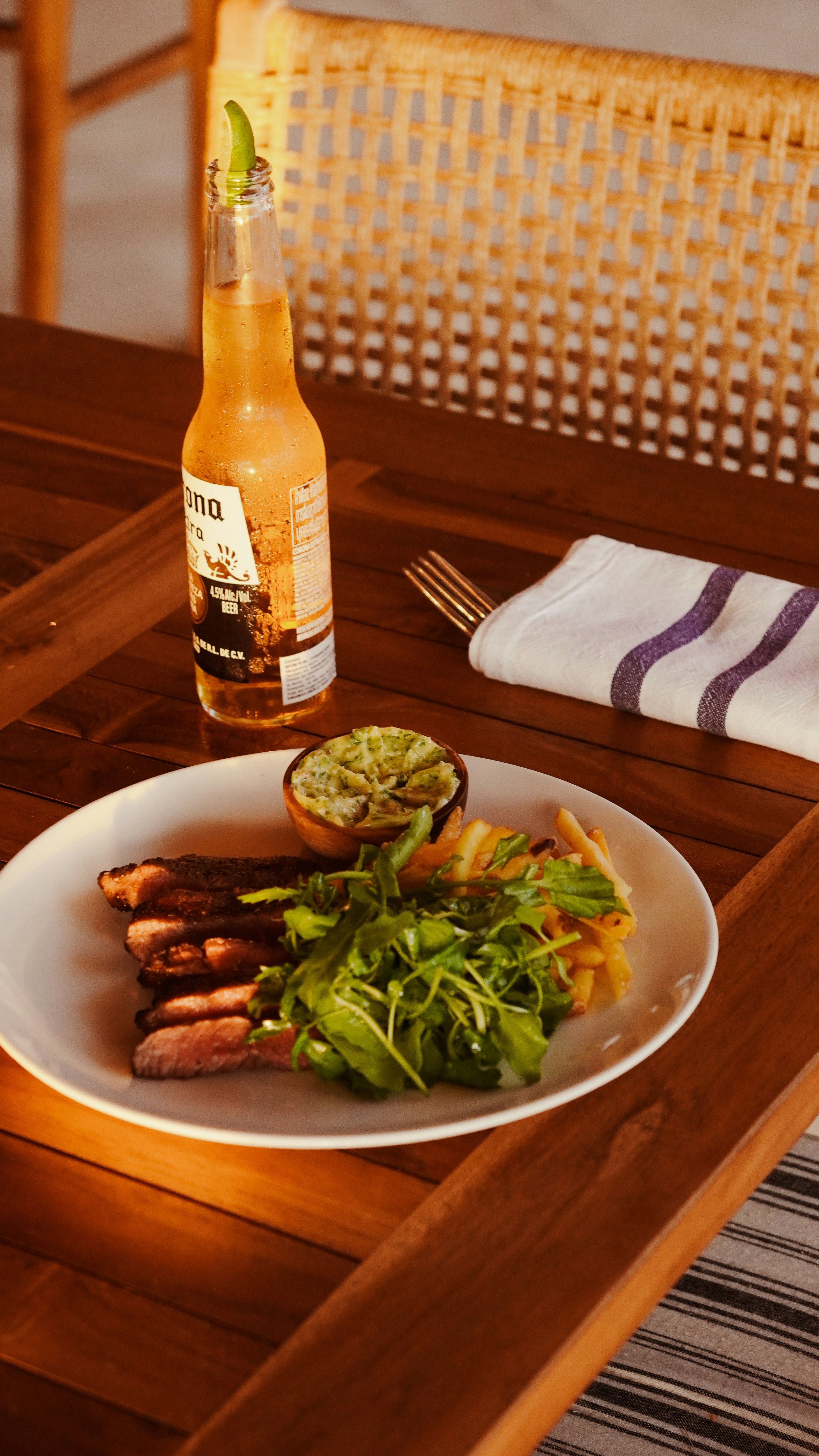 Golden Plate of Smoke-Charred Precision with a Chill Bottle