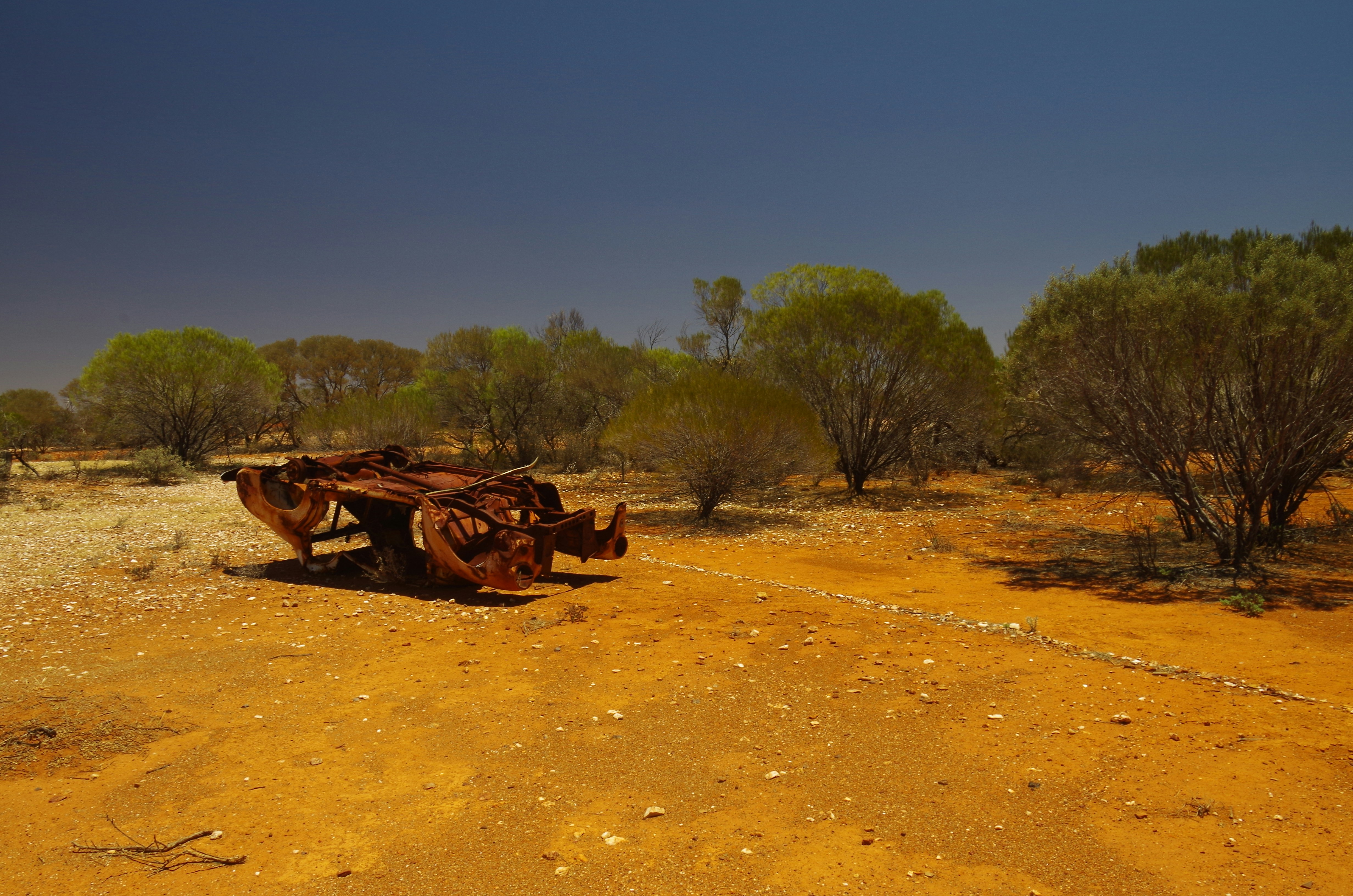 Old abandoned vehicles in the Australian outback.