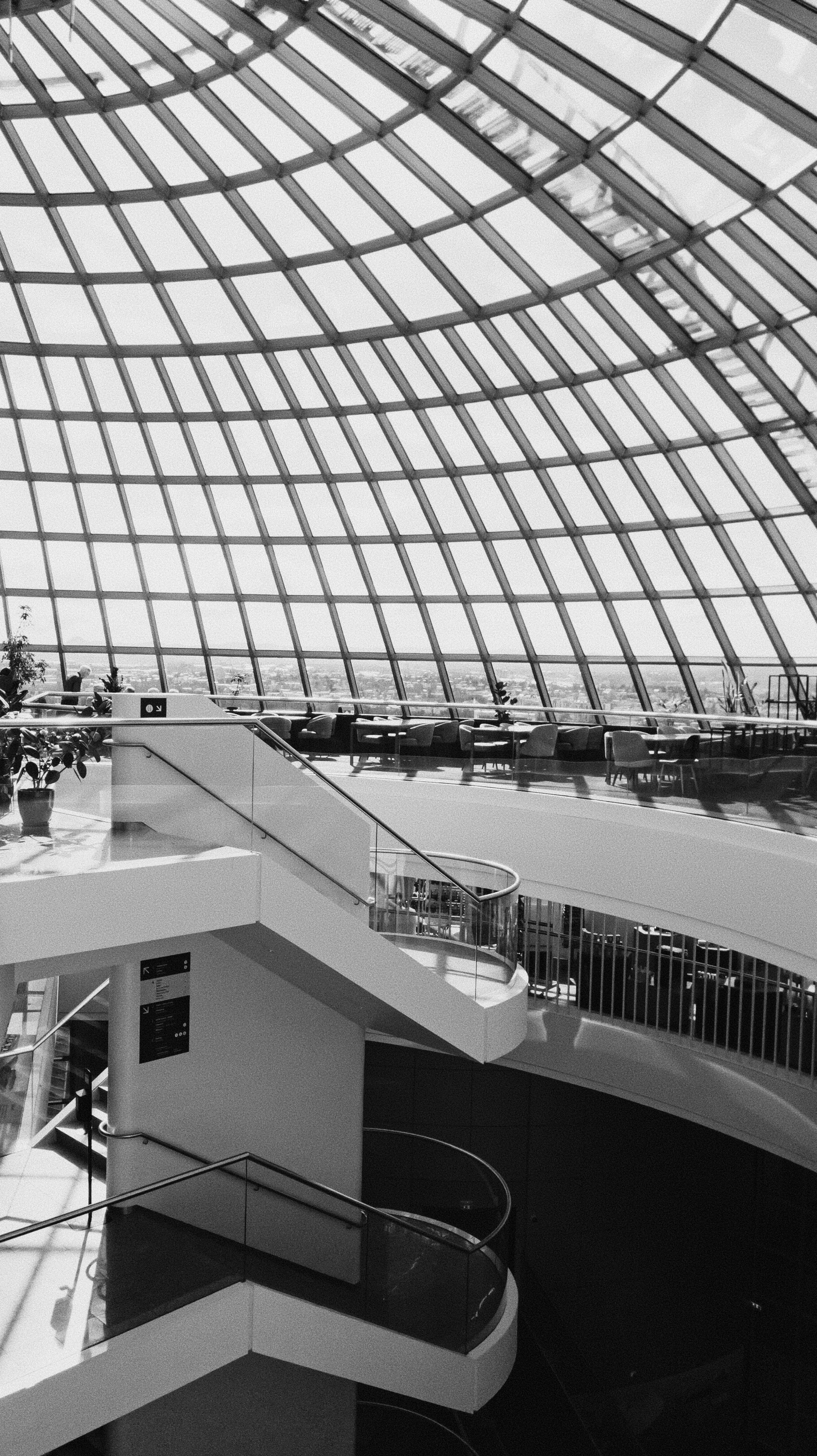 Glass Dome, Spiral Stairs: A Monochrome Atrium Portrait