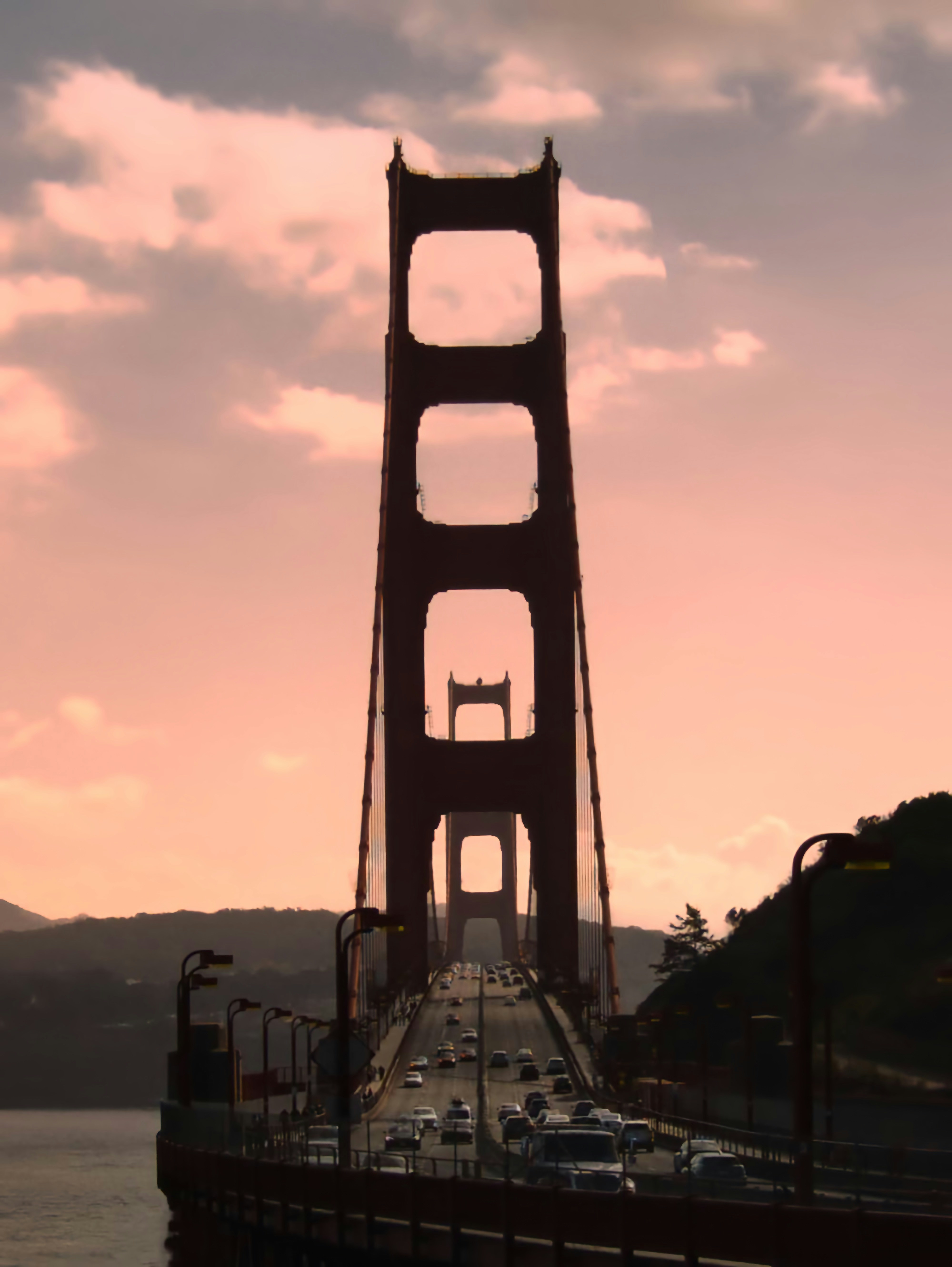 Golden Gate Glow: Sunset Pillars in a Tied-Down Traffic