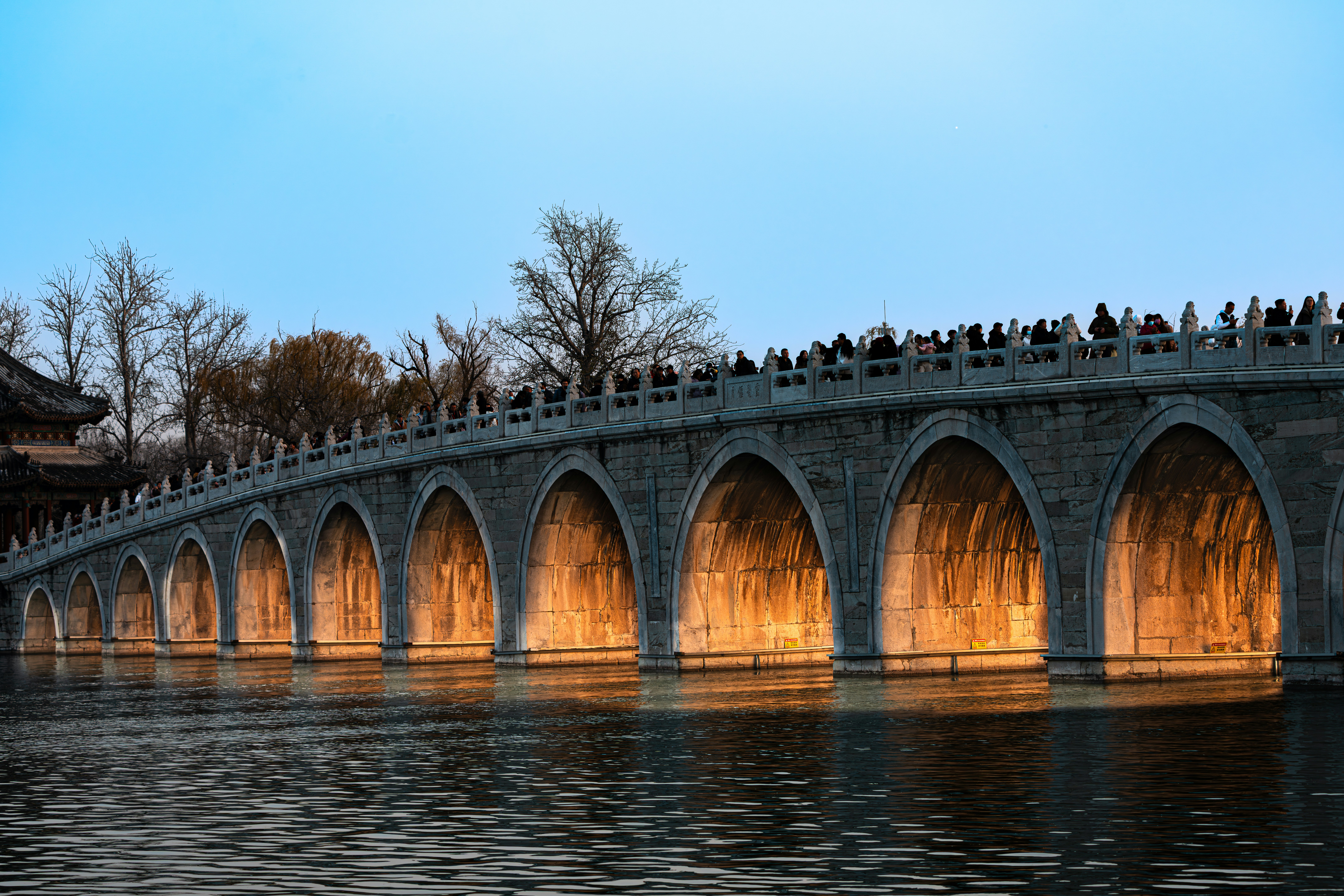 Evening Arc: Golden Light Highlights a Historic Bridge