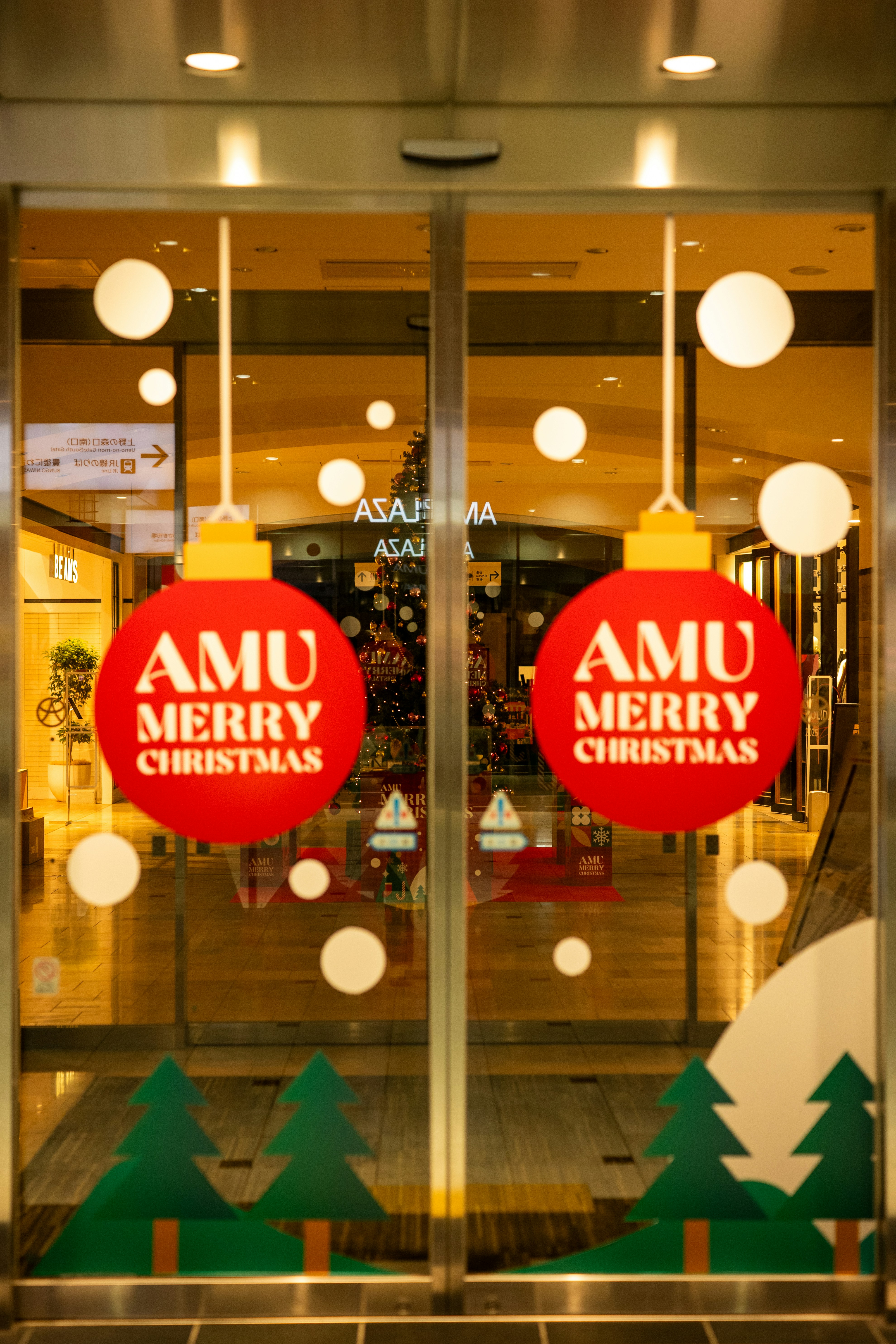Ornate Christmas Orbs Adorn a storefront Doorway