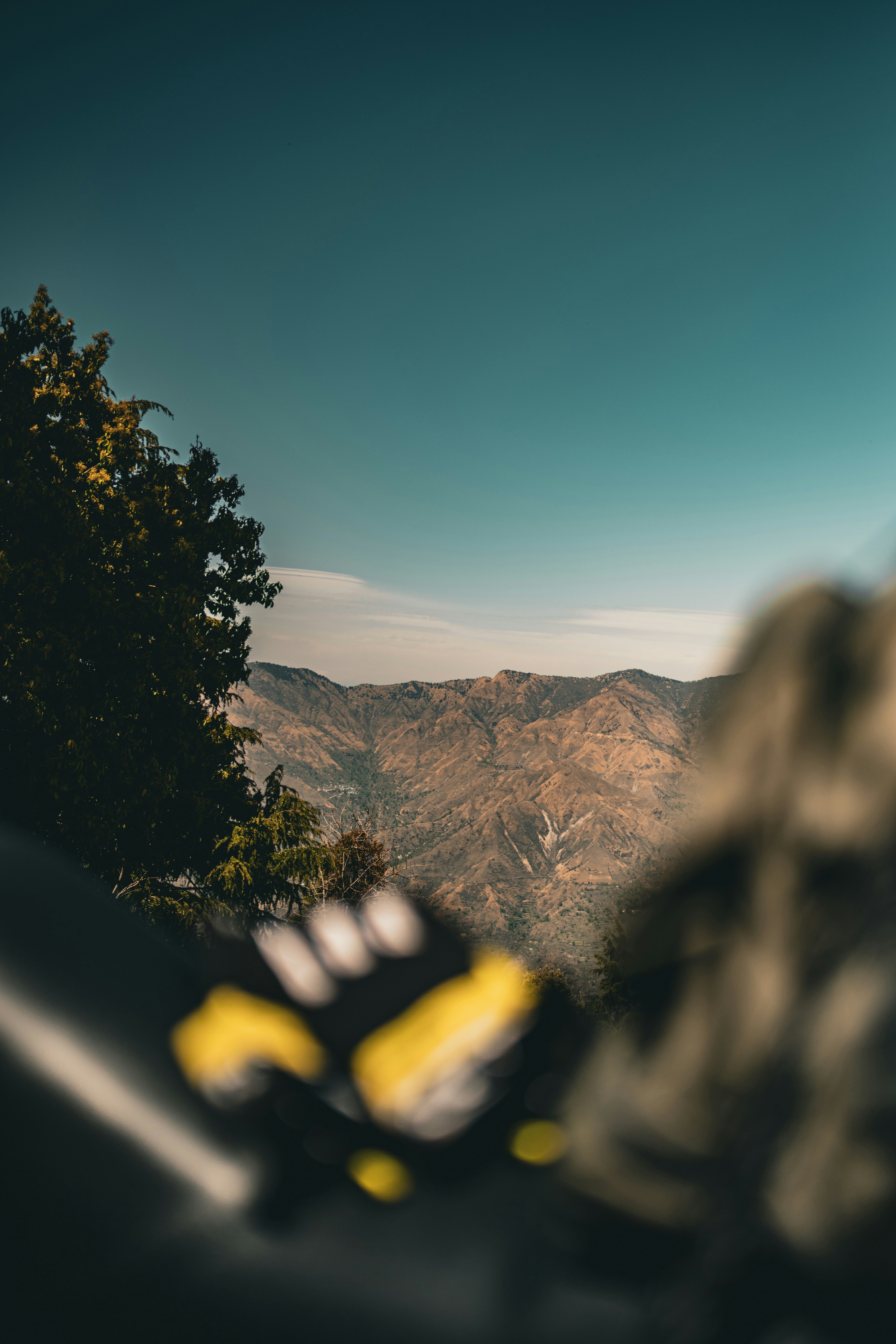 Ridgeline Echoes: Mountain Vista Framed by Blurred Gear