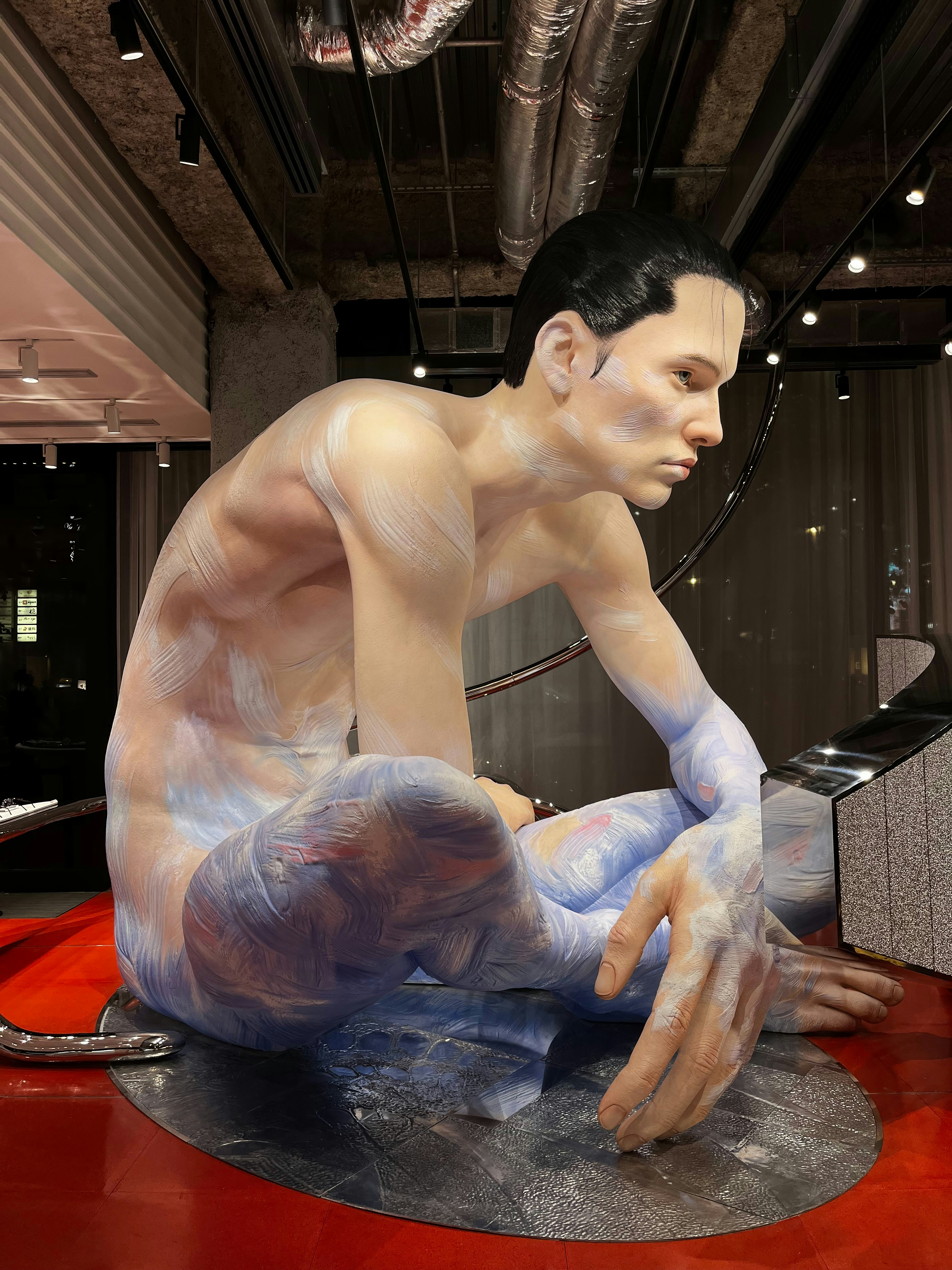 Stillness in Motion: A Painted Figure Reaches Forward