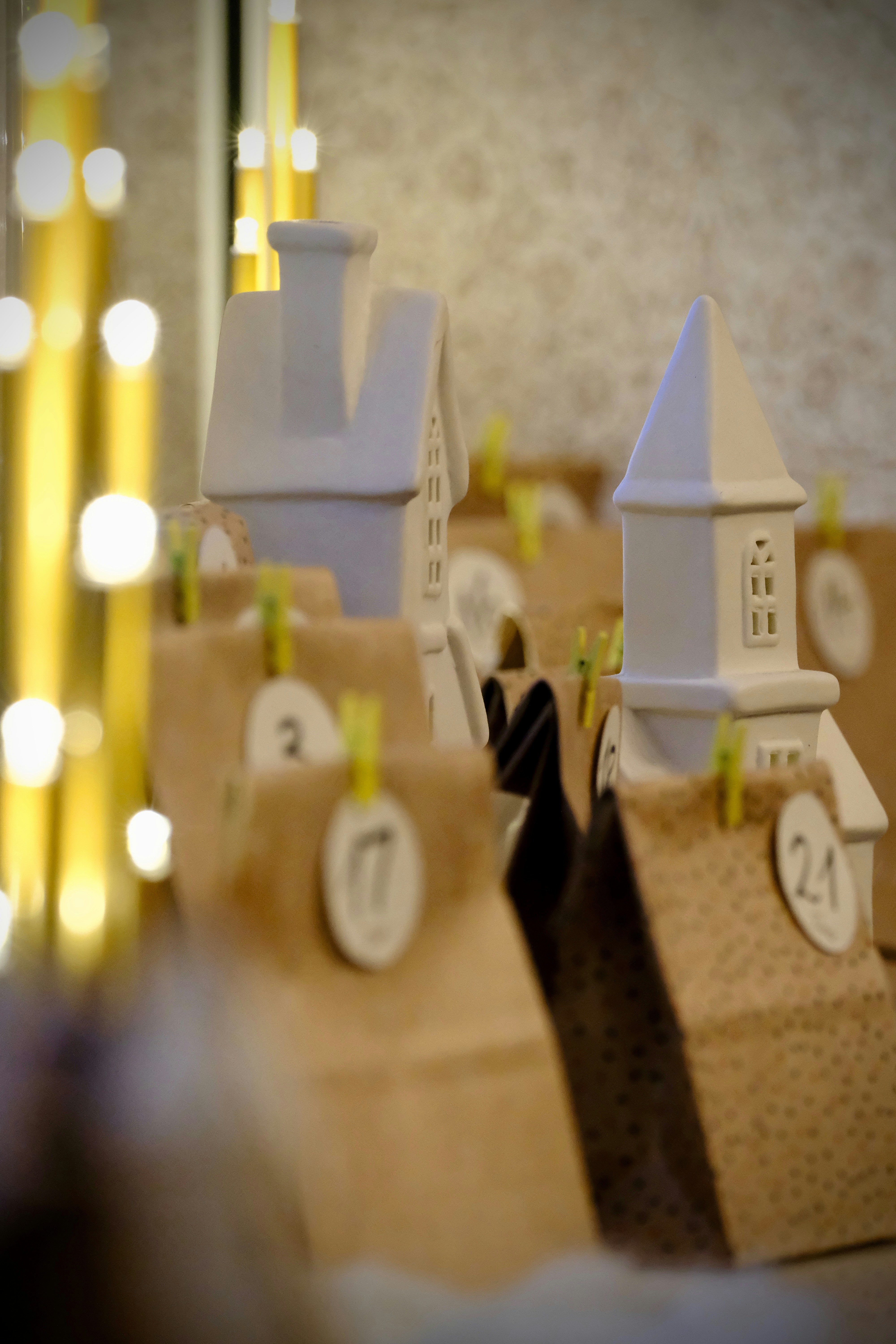 Miniature Town of White Towers Adorned with Tiny Lamps