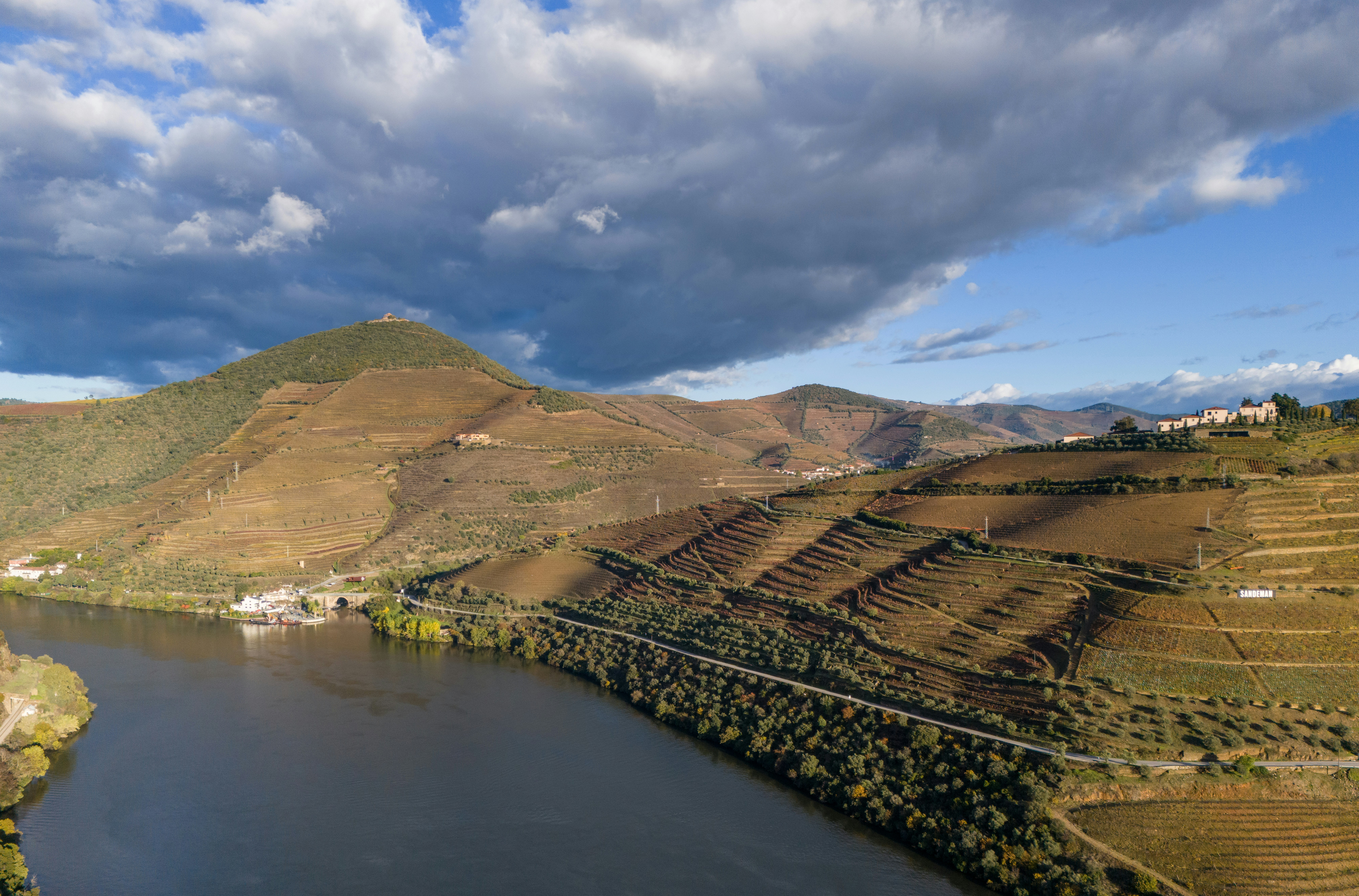 Terraced Hillsides by the River: A Quiet Confluence of Land and Water