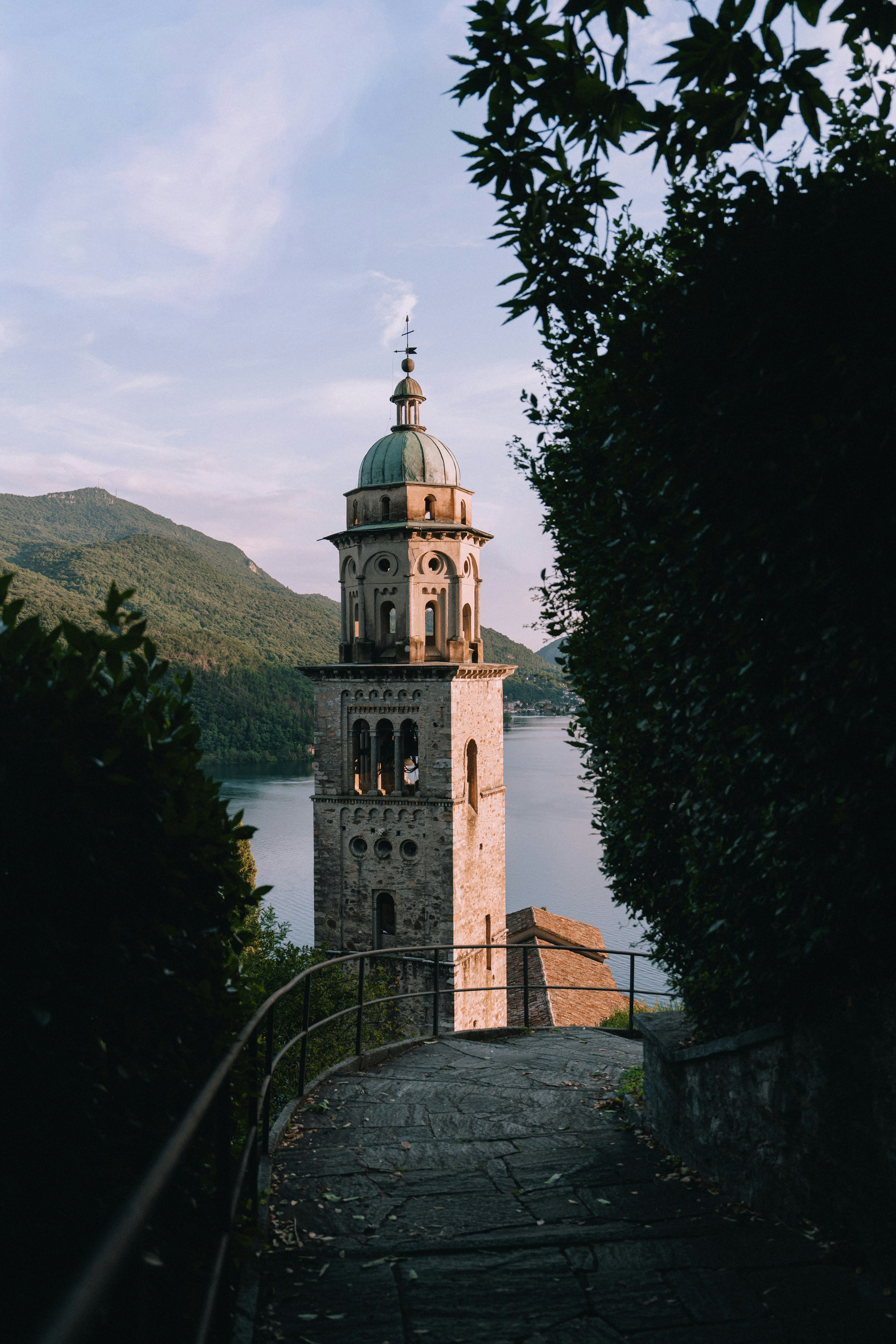 Bell Tower Above the Lake: A Quiet Path Toward the Light