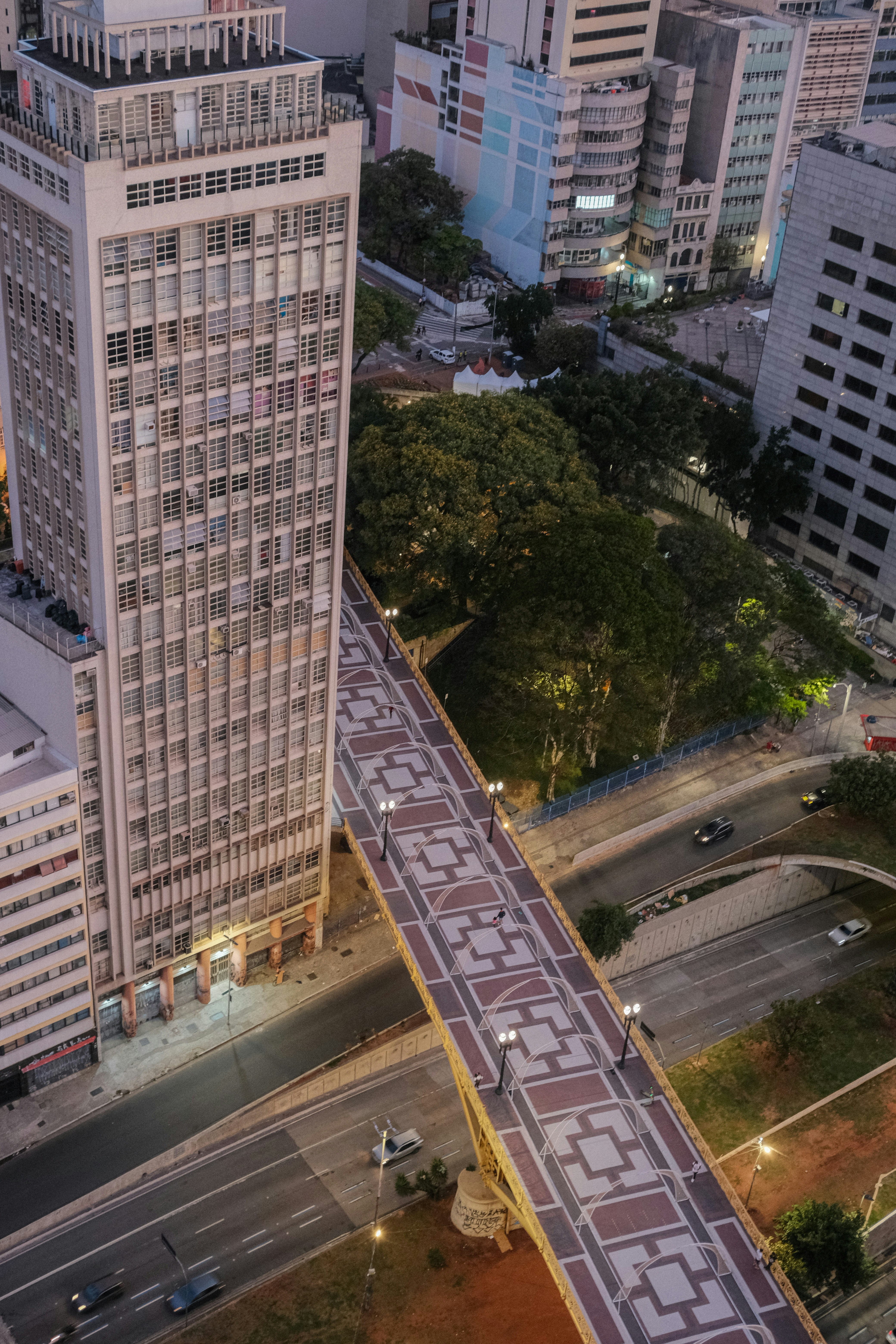 Aerial View: Pedestrian Bridge Crossing Between Skyward Towers