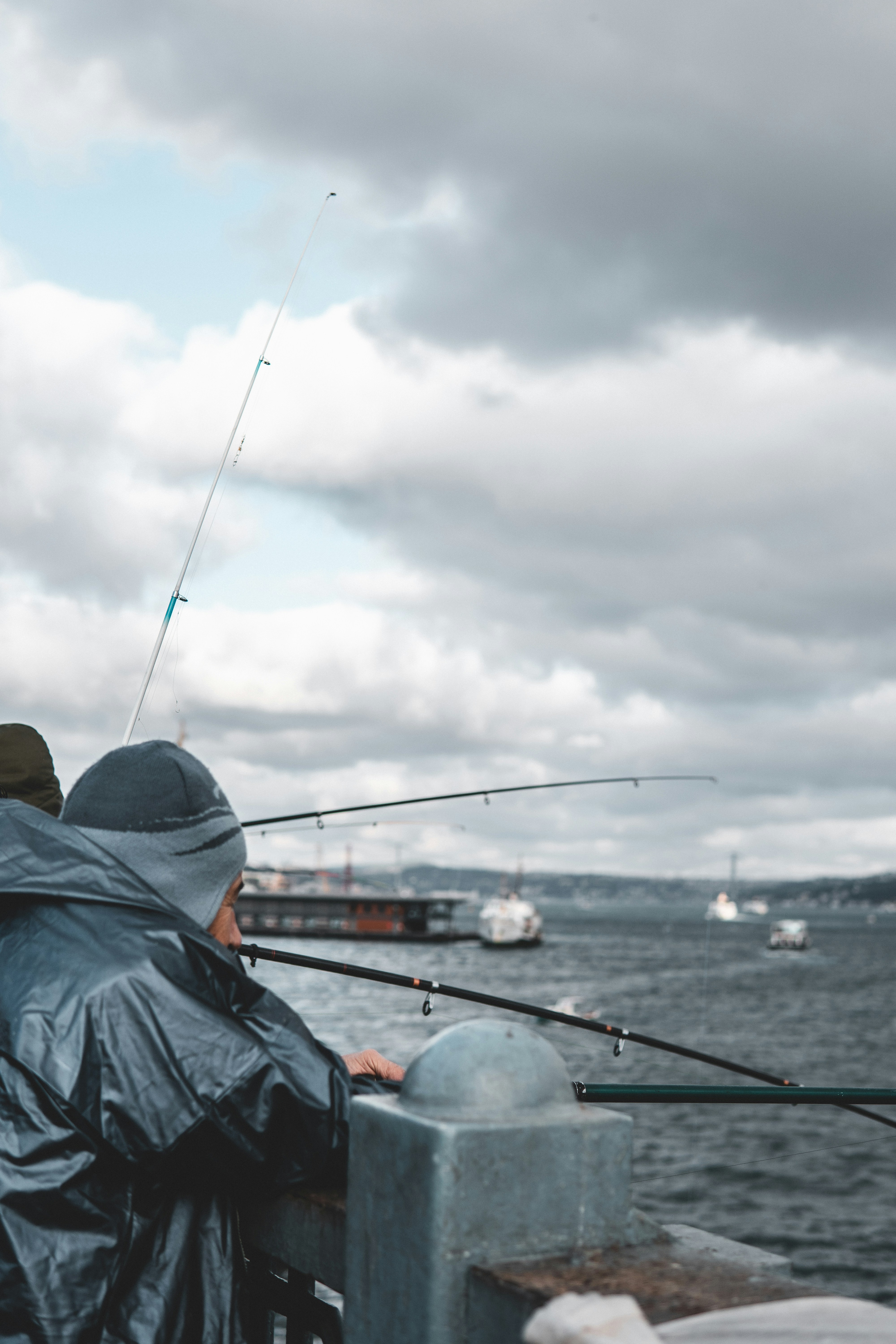 Rough Sea, Quiet Focus: Angler at the Railing