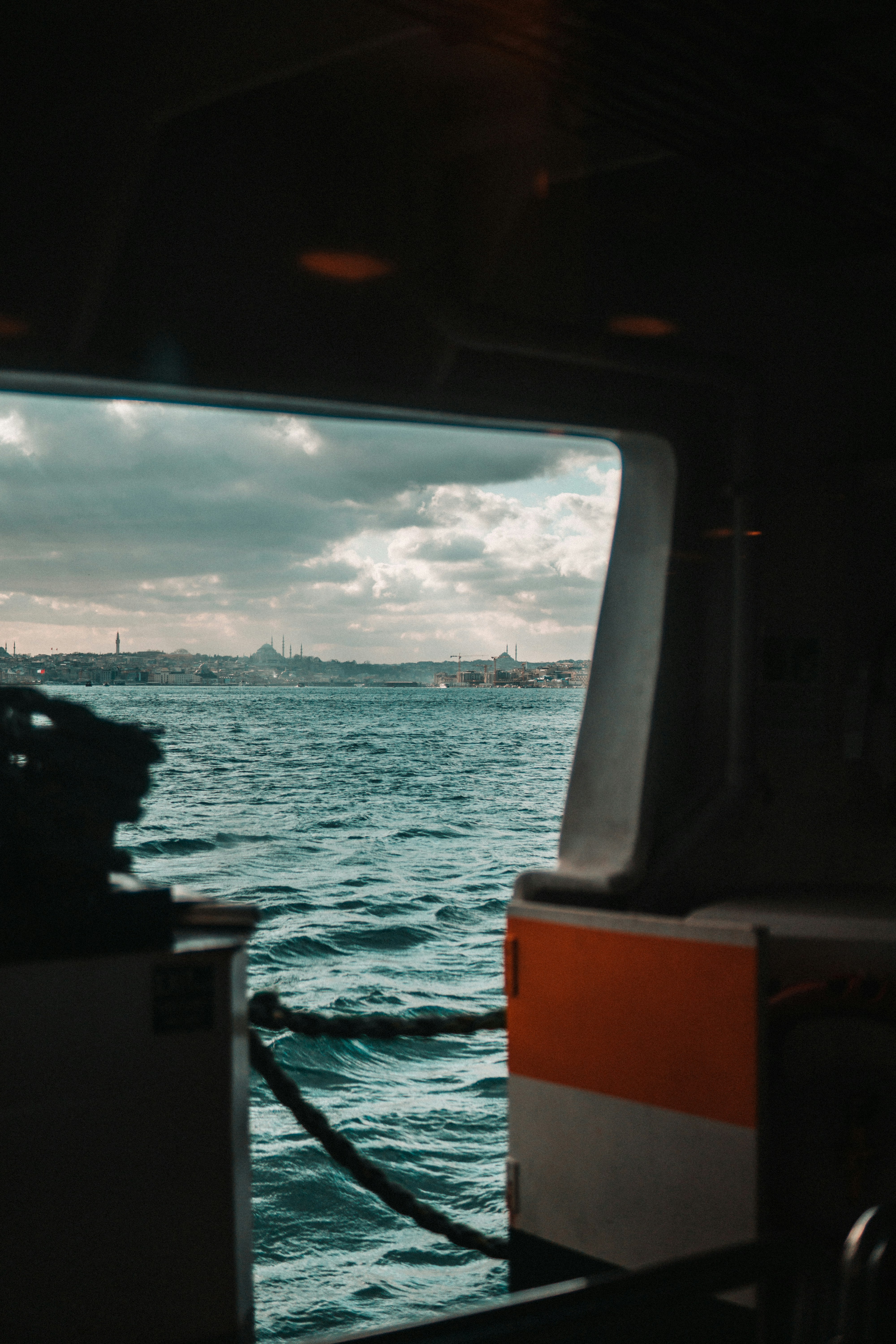 Viewport to the Open Sea: Horizon Framed by a Vessel Window