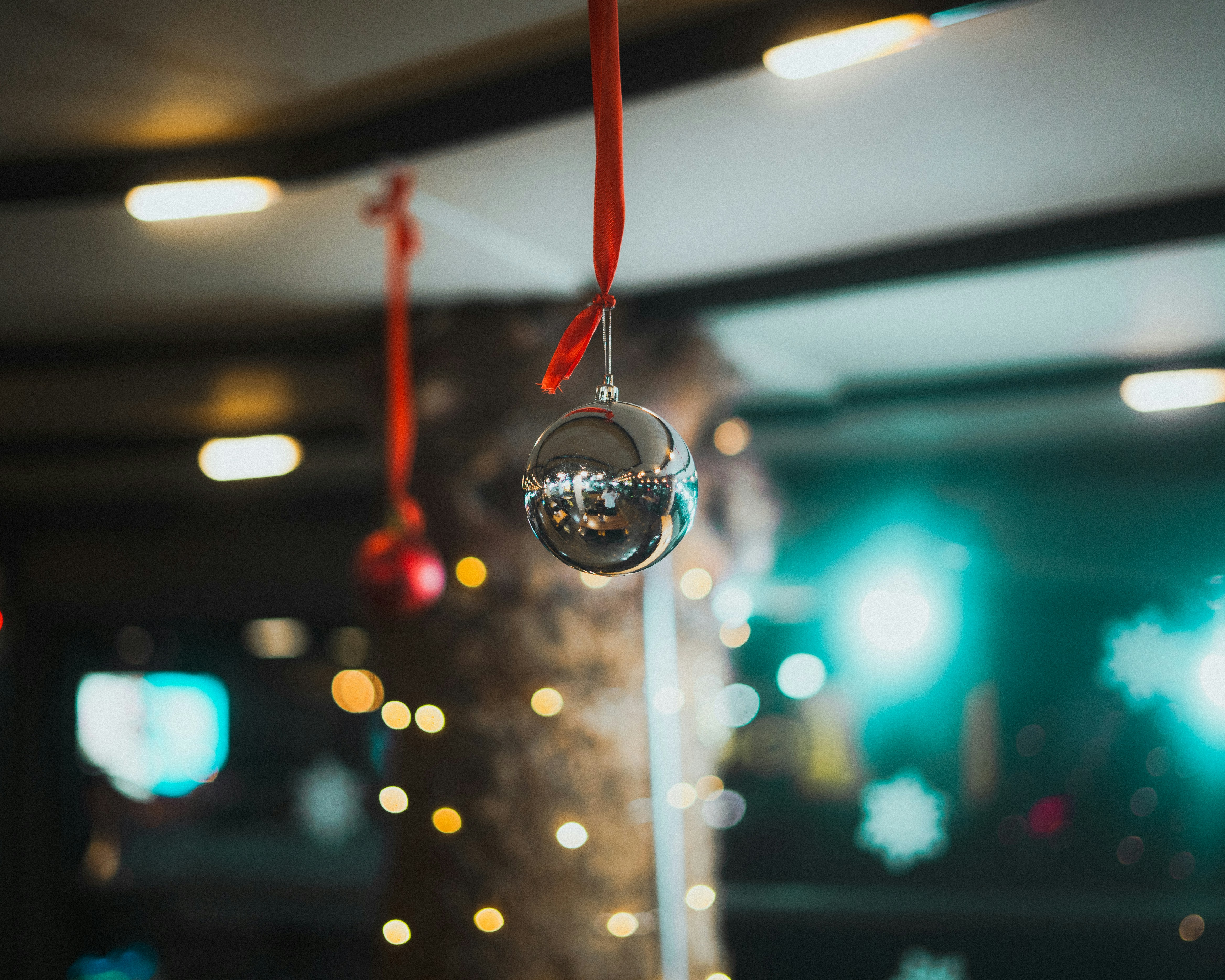Silent Ornament: A Glinting Christmas Ball in a Night Teal Glow