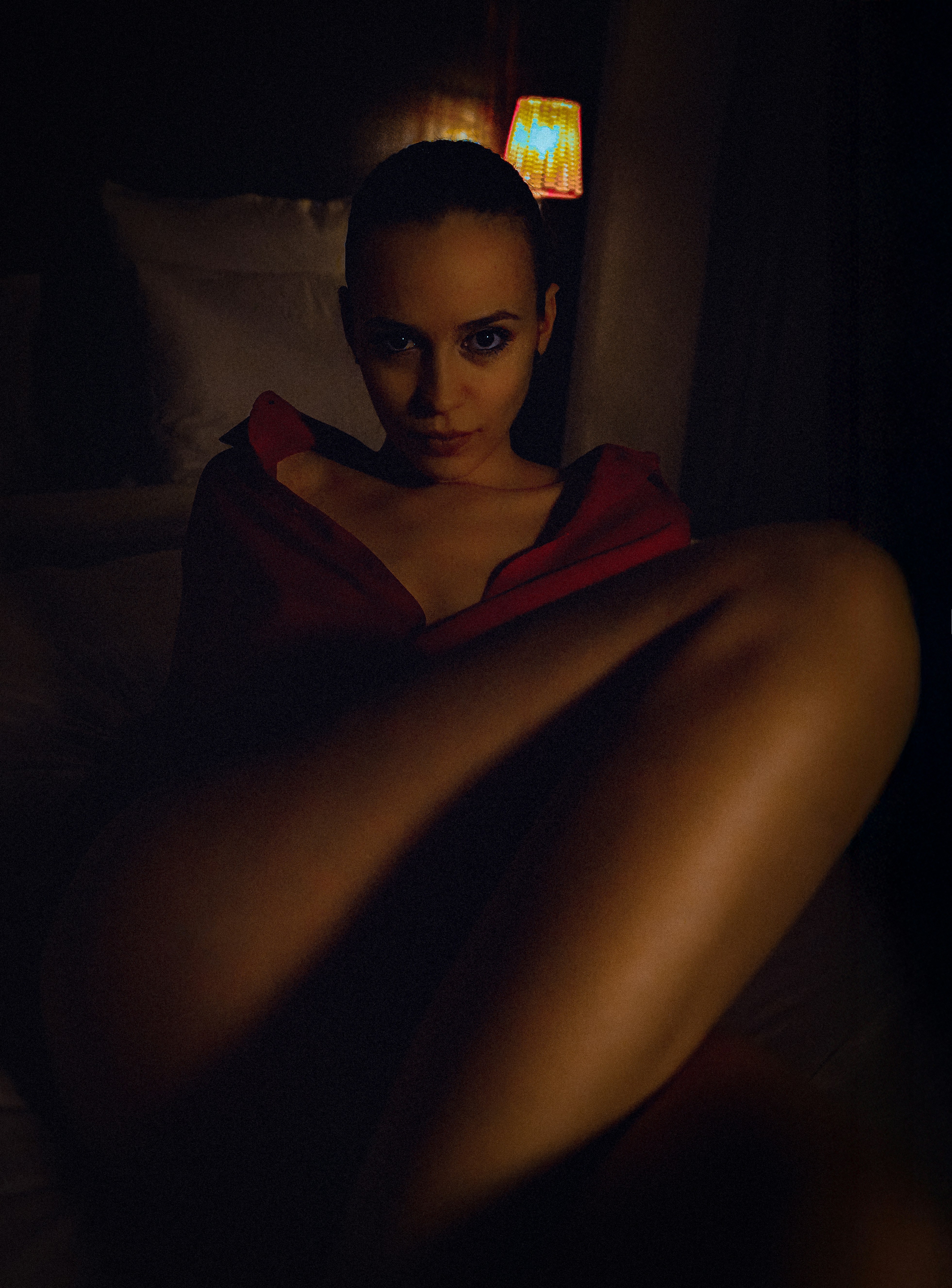 Midnight Lounge: A Shadowed Gaze in Velvet Red