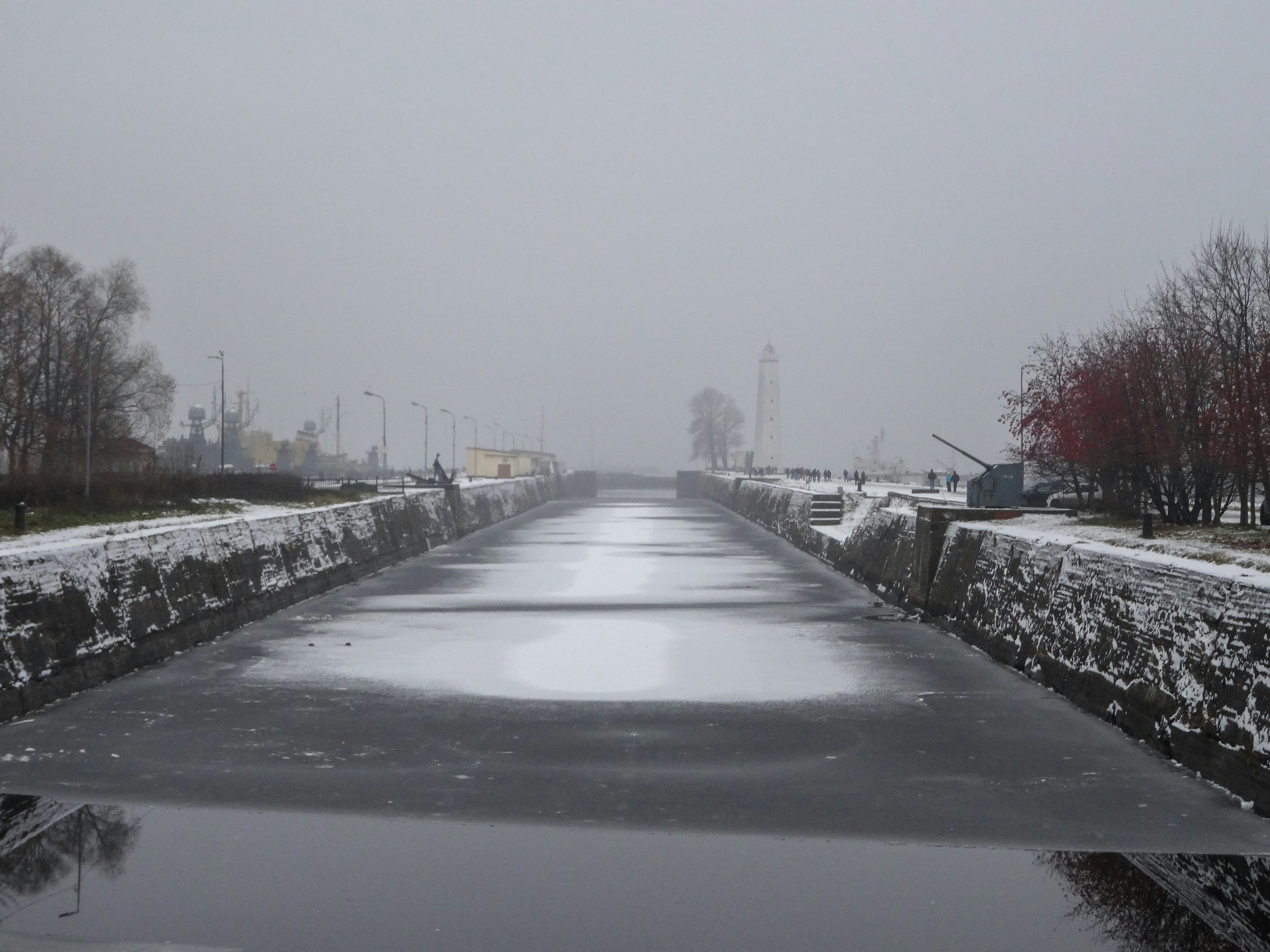 Winter Canal Reflections Under a Cloudy Sky