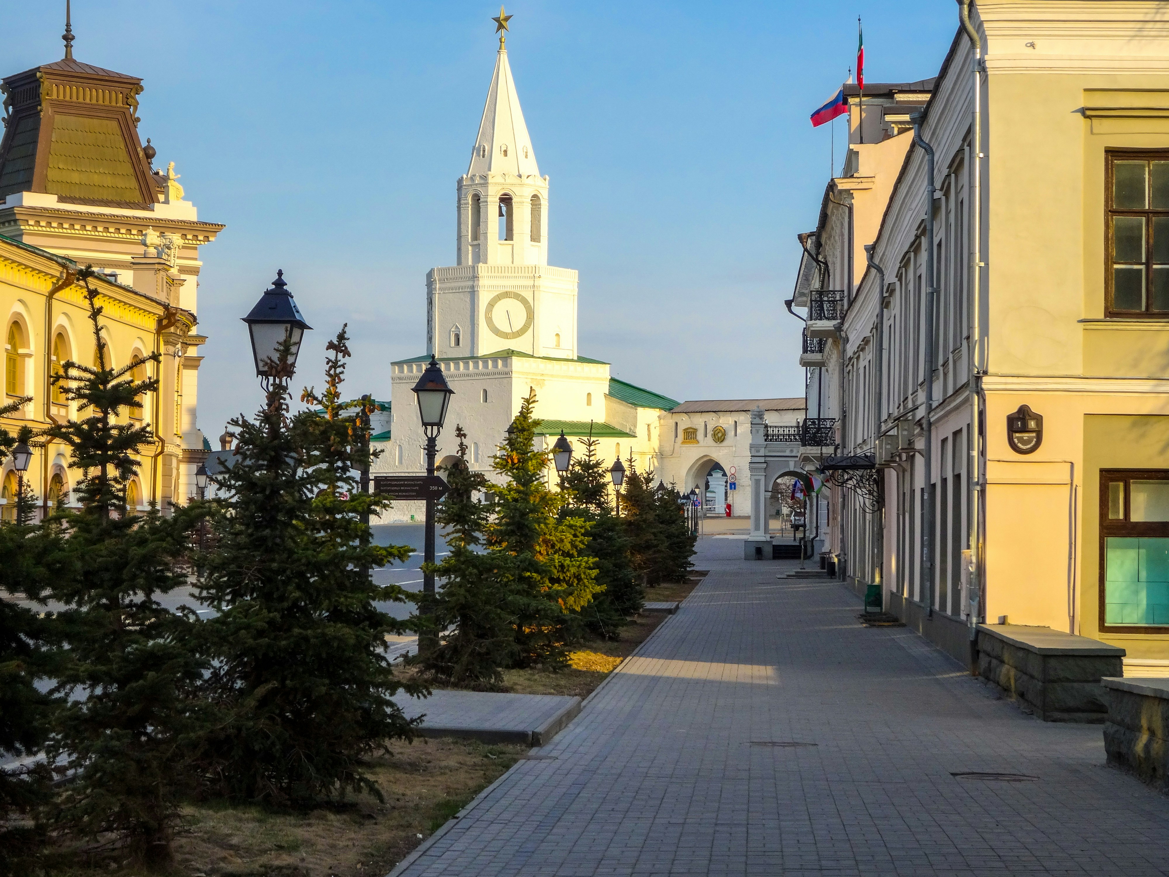 A street scene with historic buildings and a clock tower.