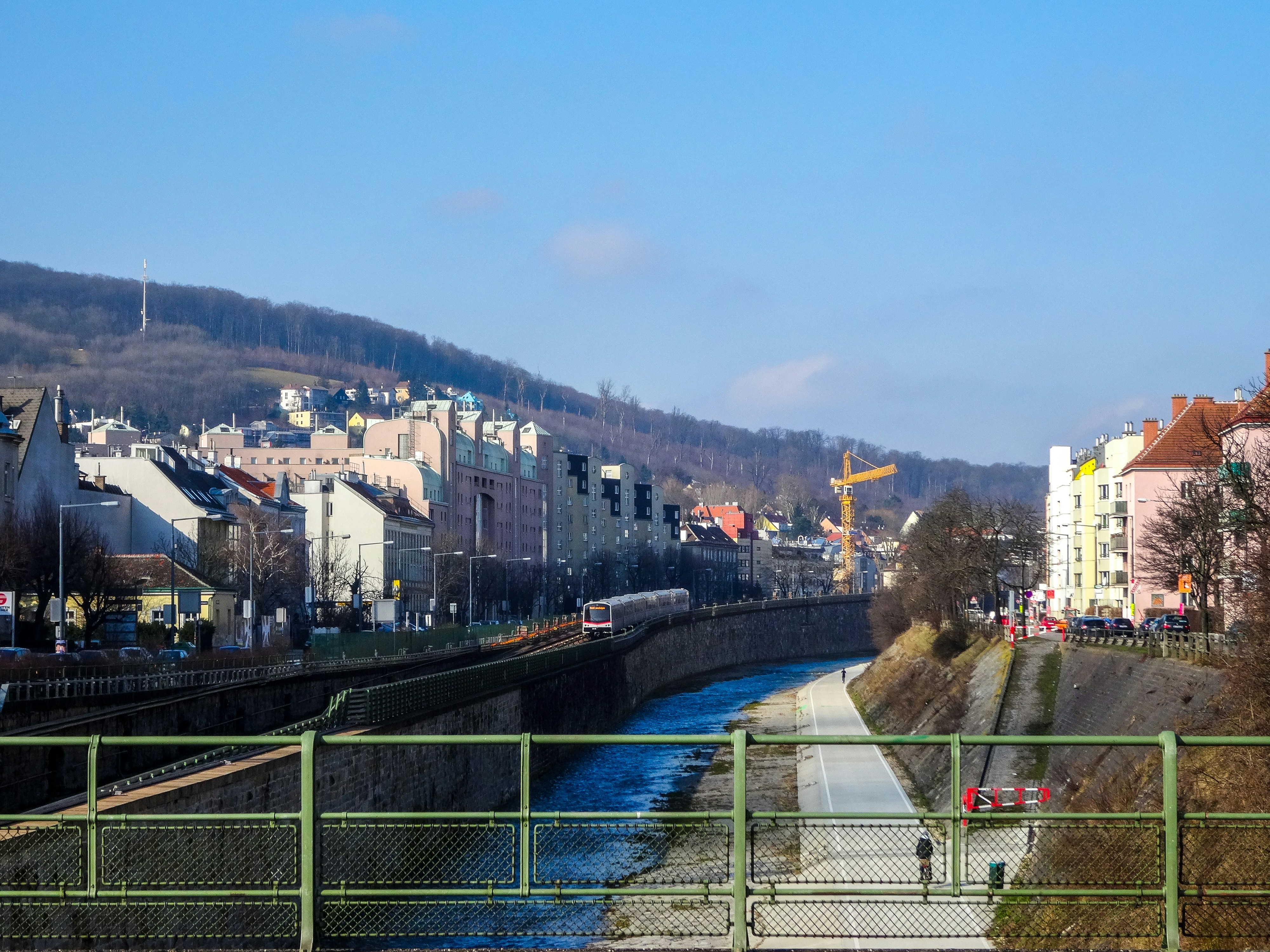 Riverside Boulevard: Cityscape beneath a Mild Blue