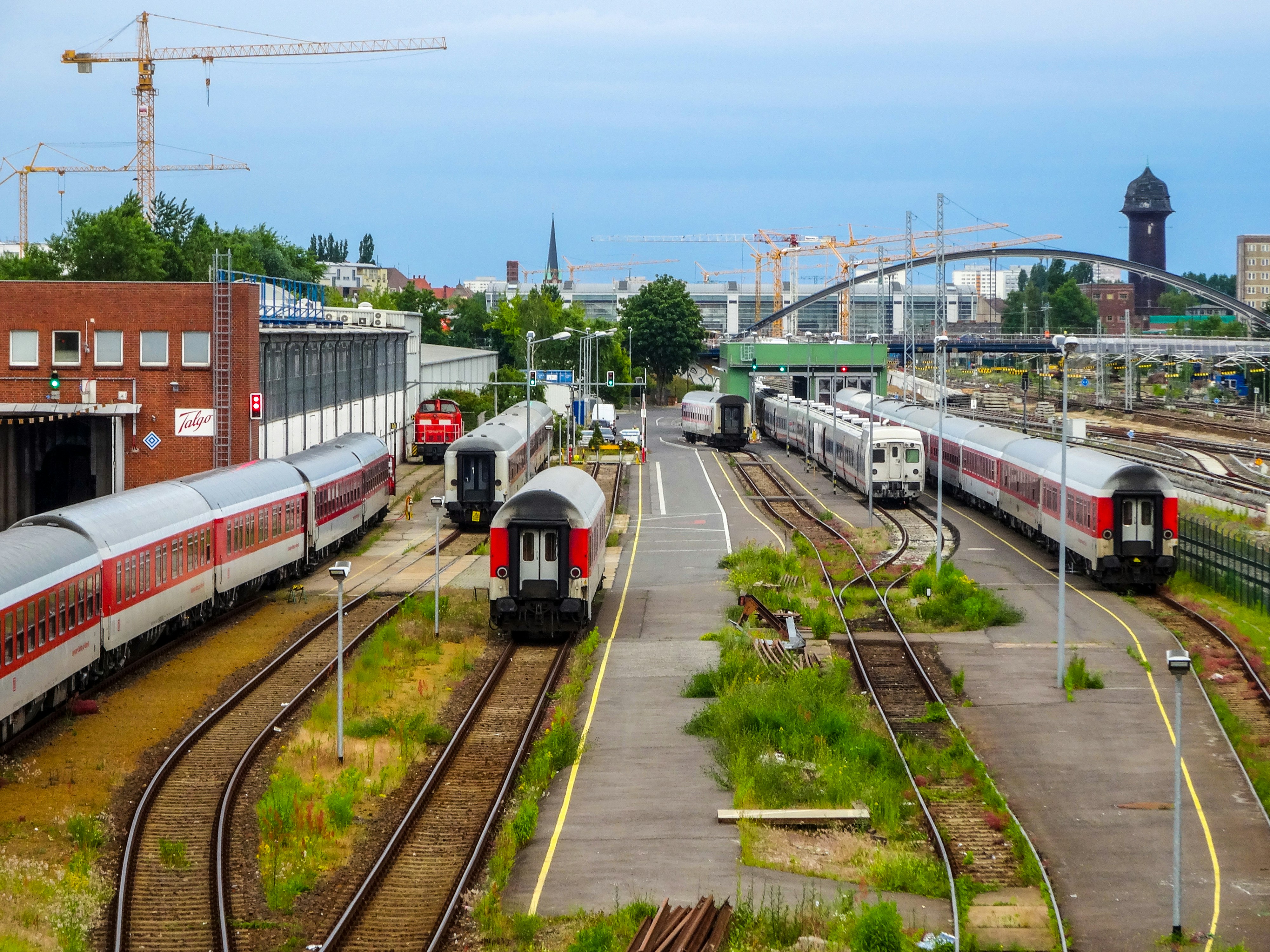 Trains at a railway station with multiple tracks.
