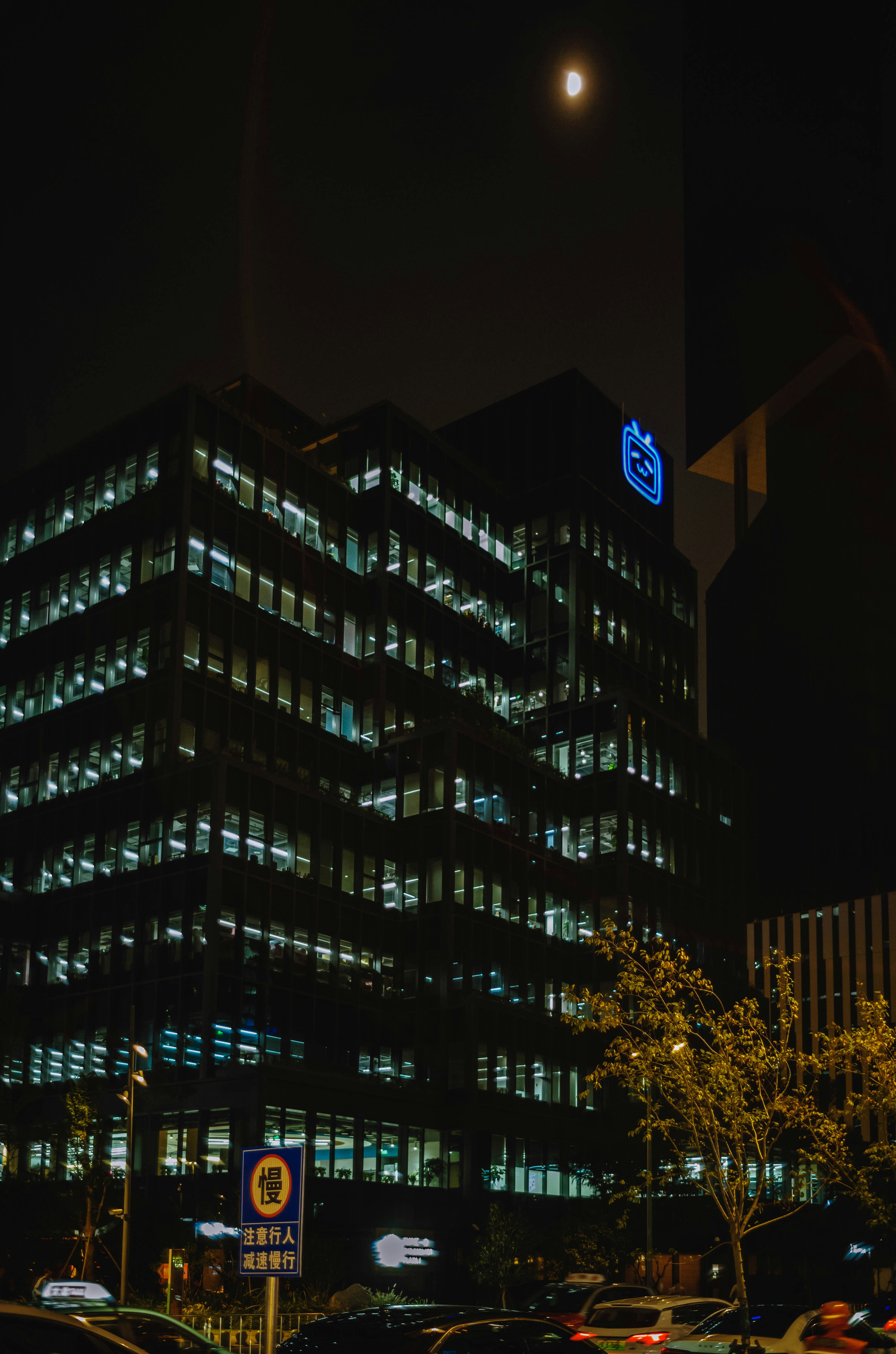 Moonlit Glass: Neon Geometry Above a Quiet Street