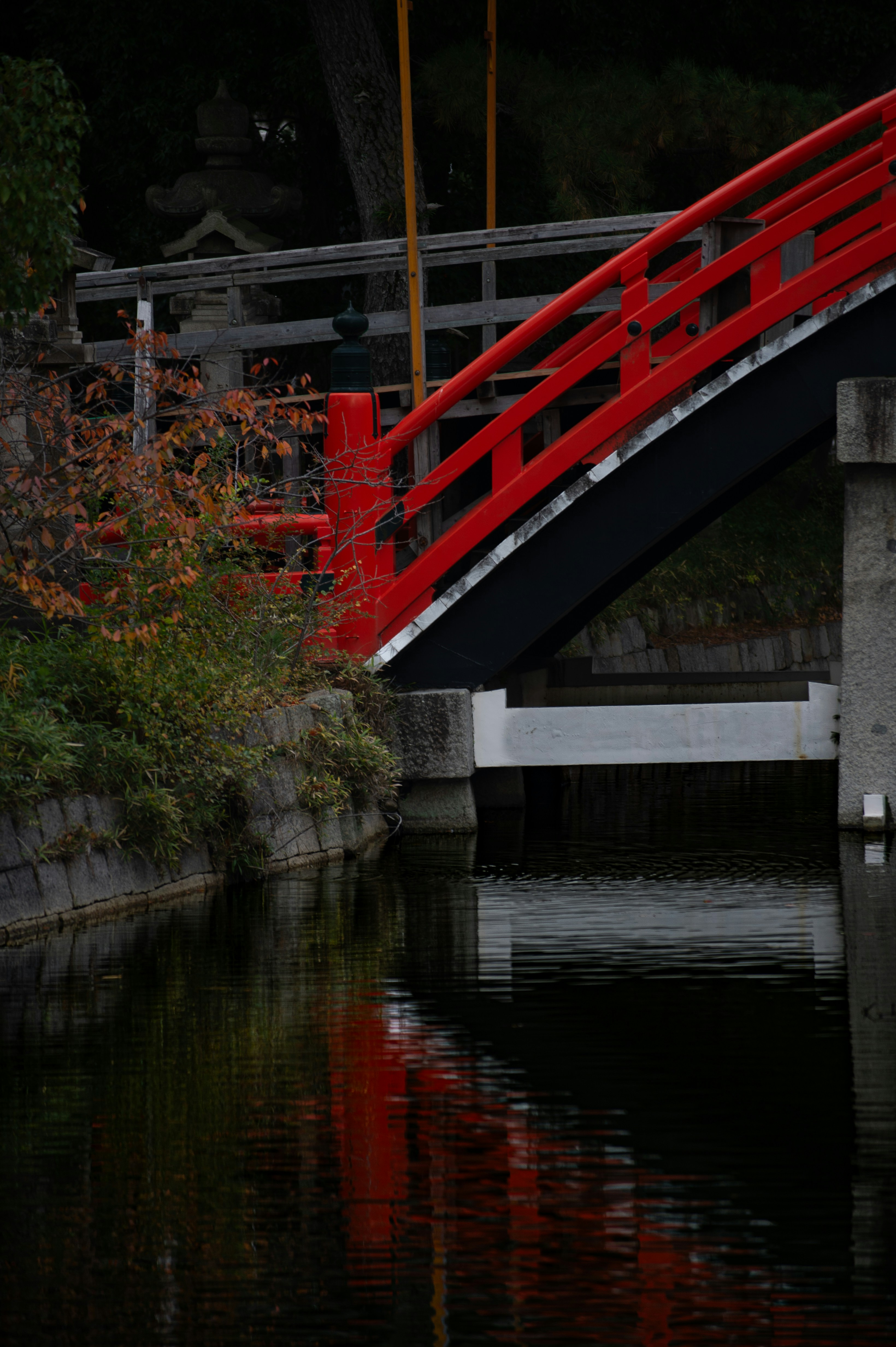 Crimson Arch Over Quiet Water: A Bridge in Twilight