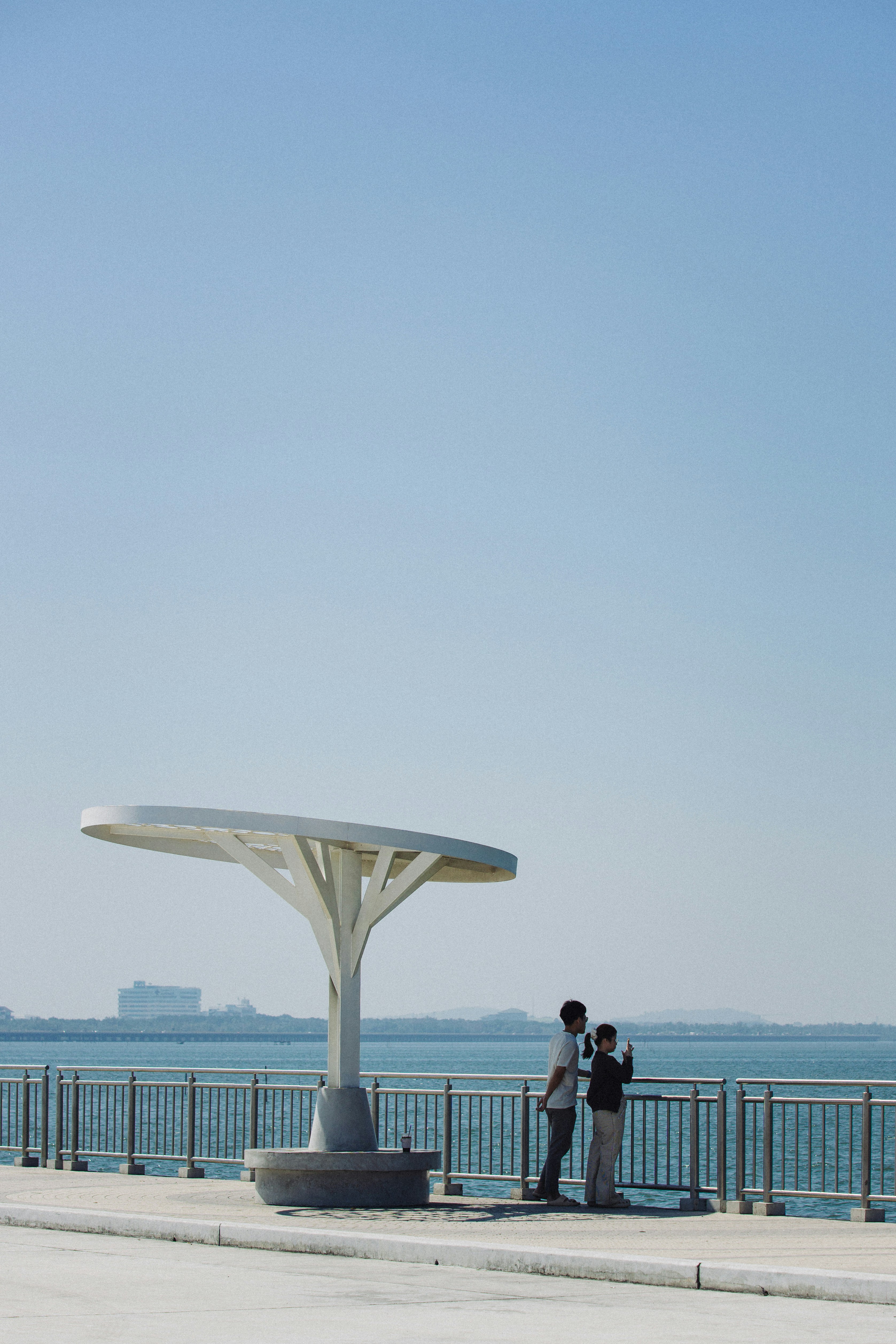 Coastal Observatory: Three Figures by the Rail
