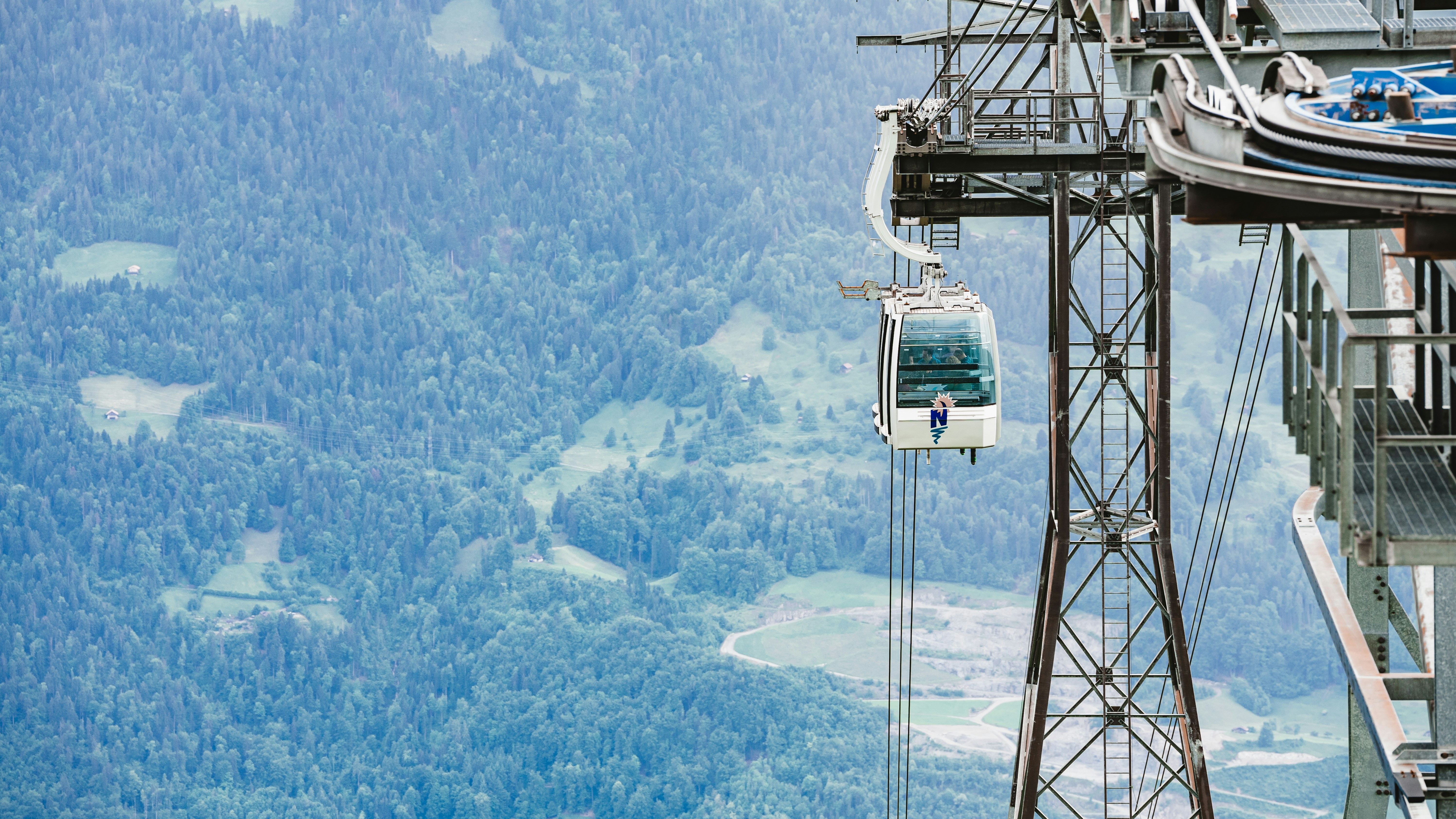 Cable Car Over Alpine Valleys: A Glimpse of Motion and Heights