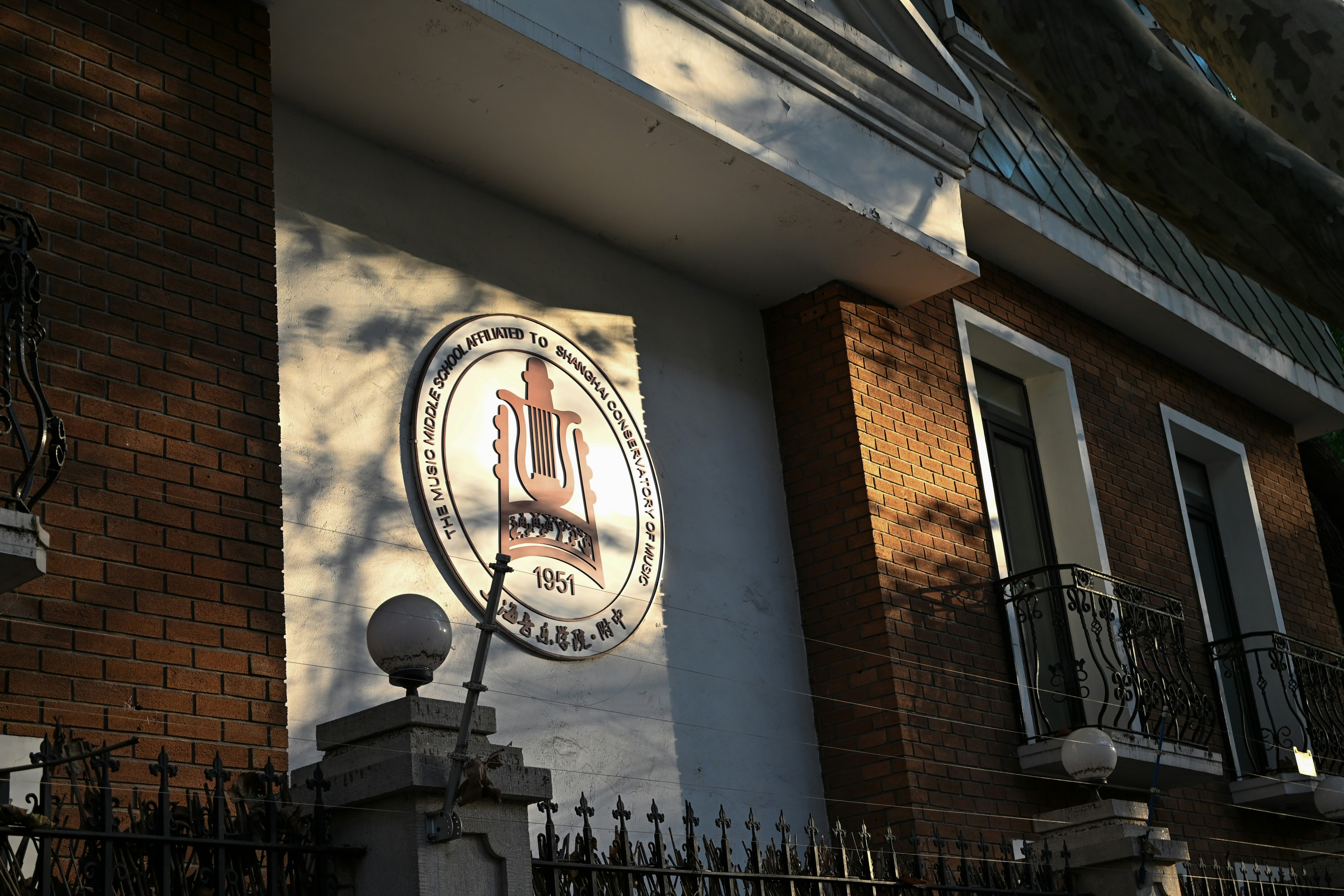 Heralded Emblem on a Sunlit Facade