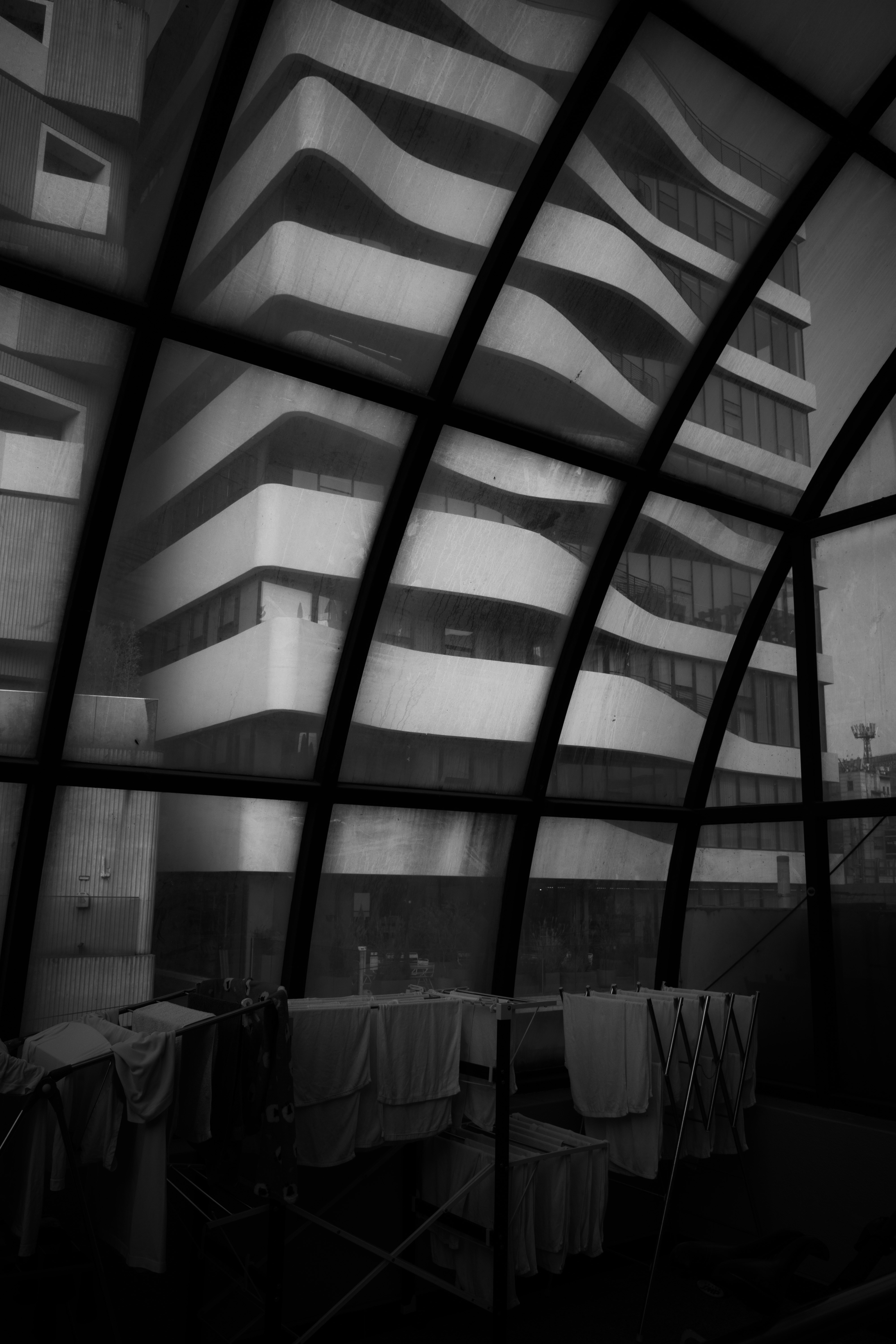 Grid of Shadows over a Curved Facade