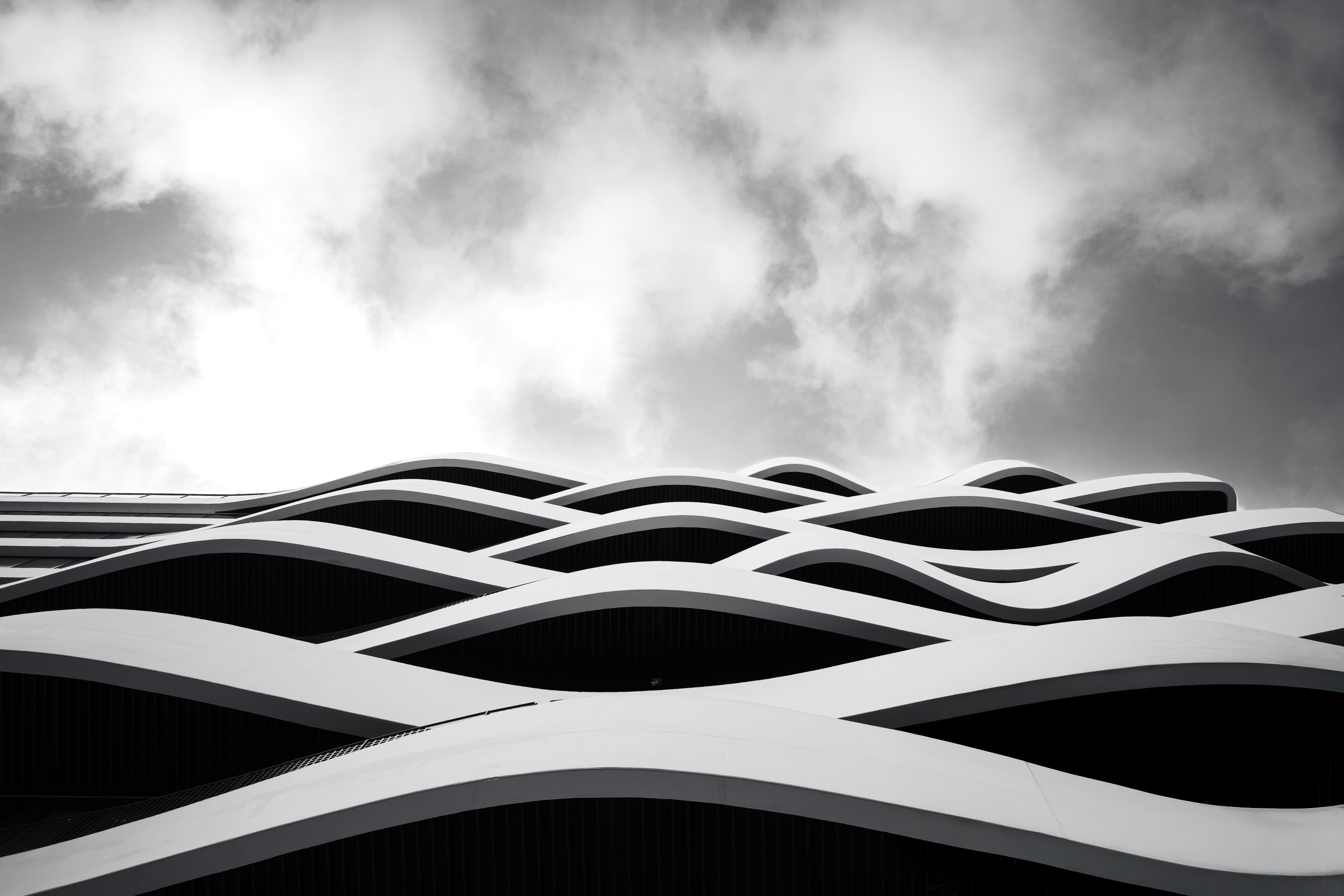 Wavelike Architecture Against a Sky of Steam