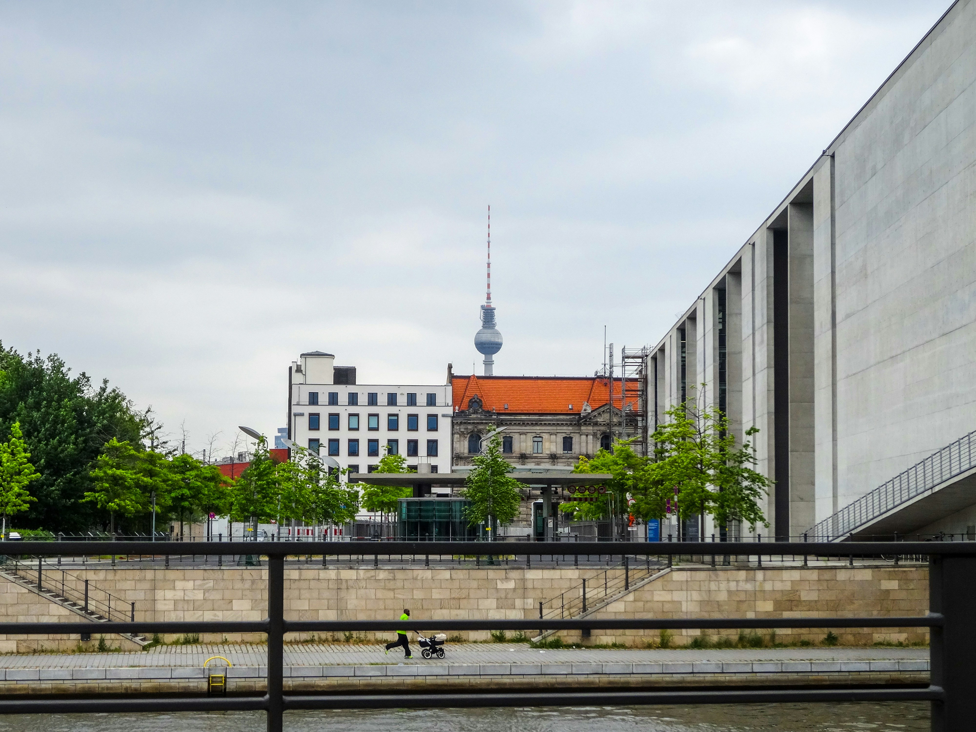 The Riverside Skyline: A Quiet Urban Moment by the Spanning River