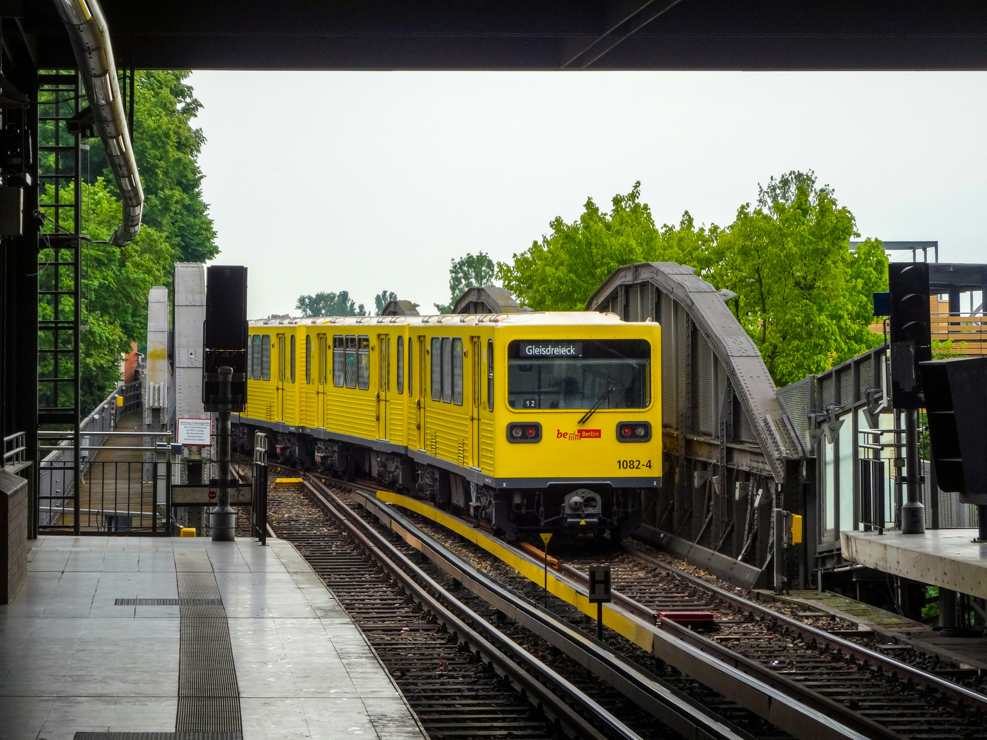Yellow Line Crossing: A Commuter Train Approaches a Modern Platform