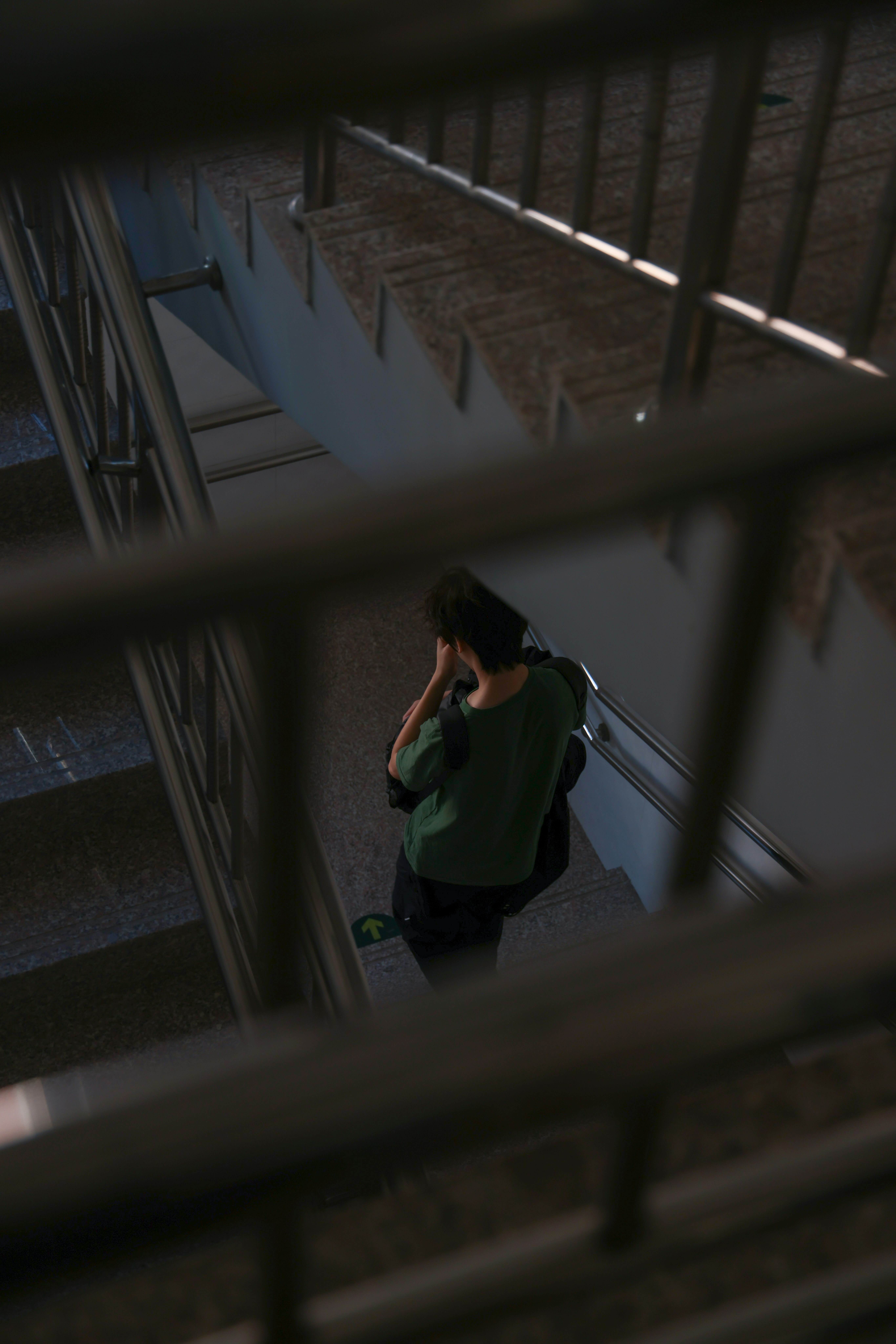 Silent Climb: A Figure on the Dim Staircase