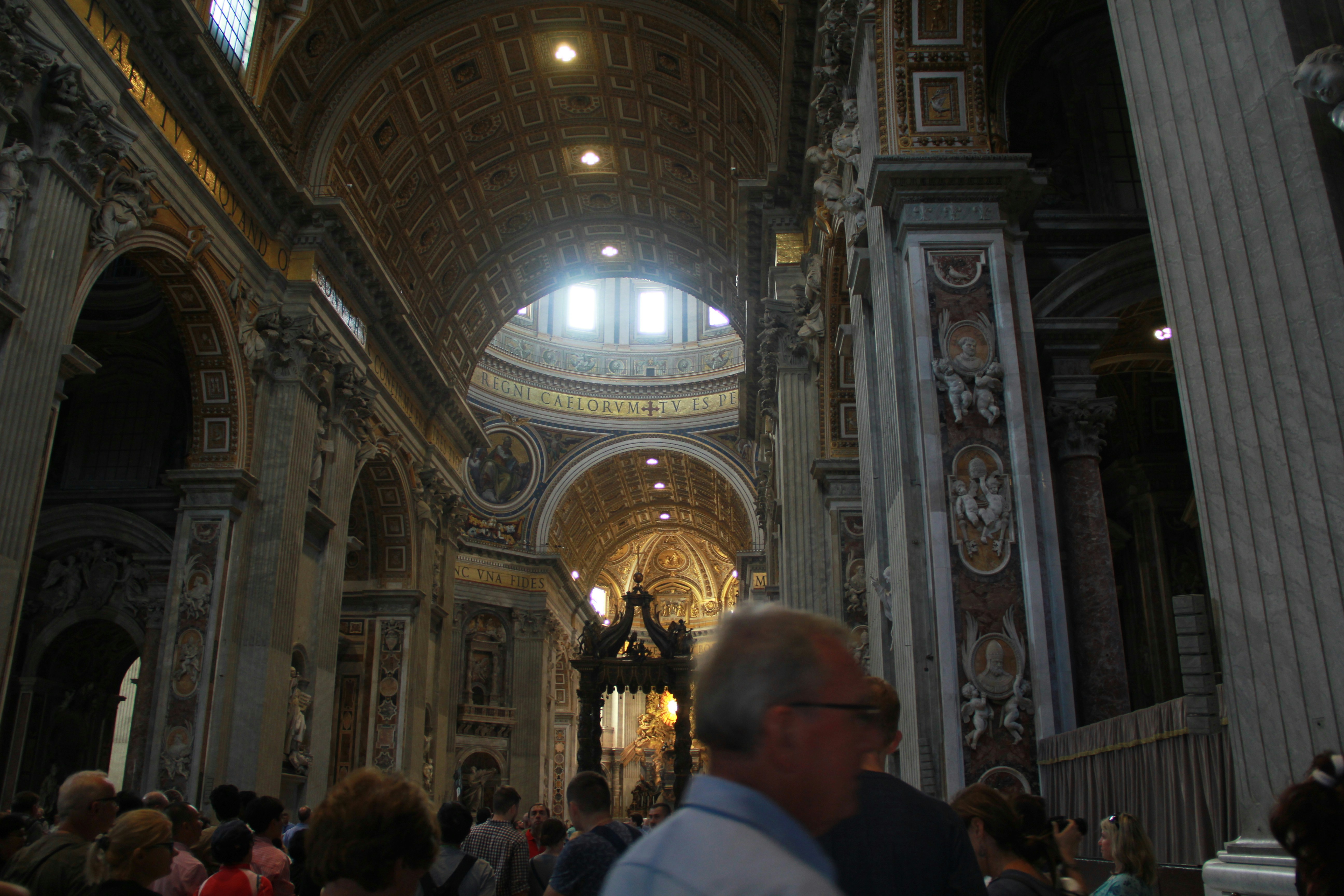 Cathedral Grandeur: A Crowd Beneath Baroque Vaults and Central Shrine