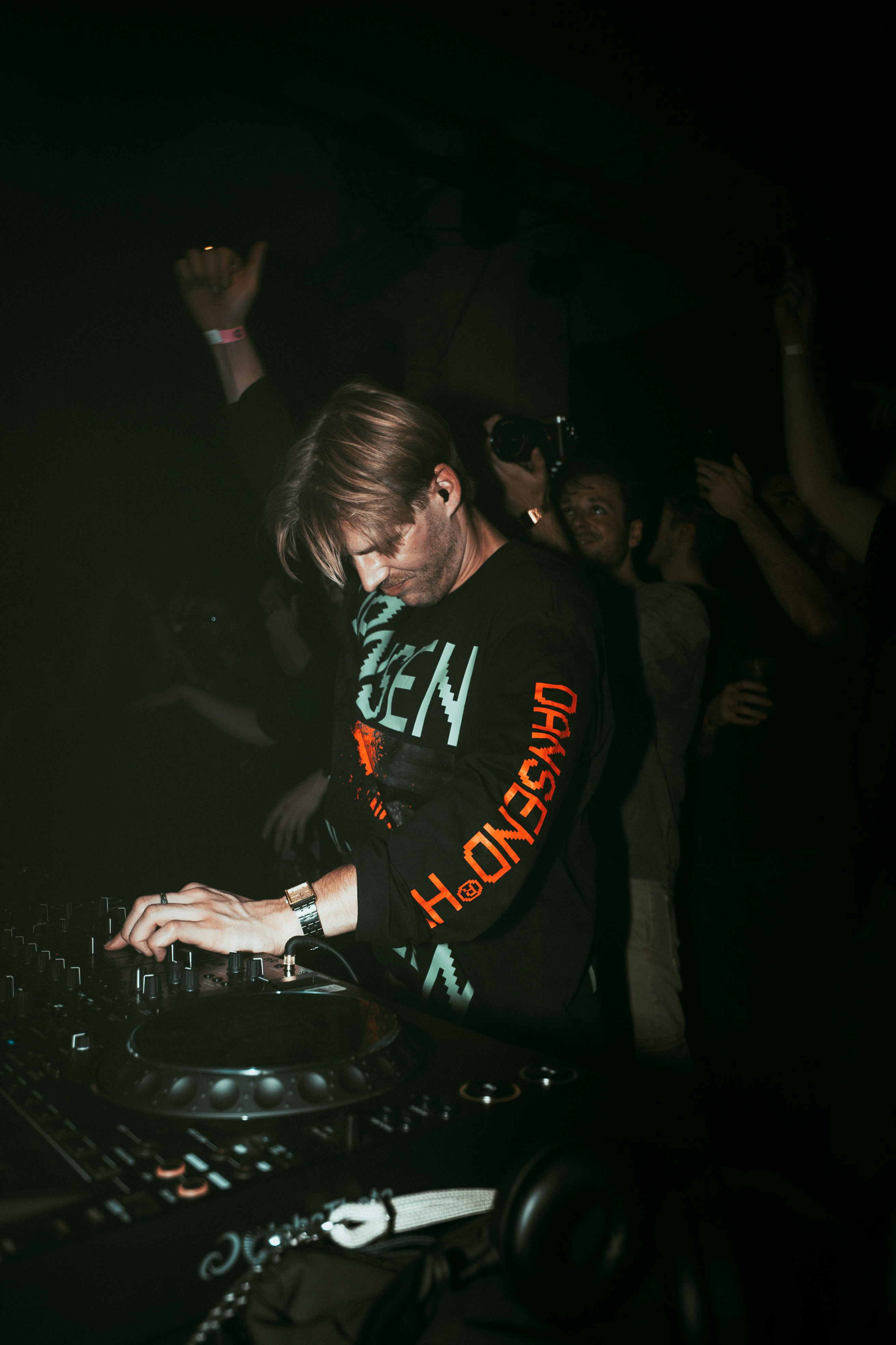Midnight Pulse: The DJ at the Deck Drops the Beat