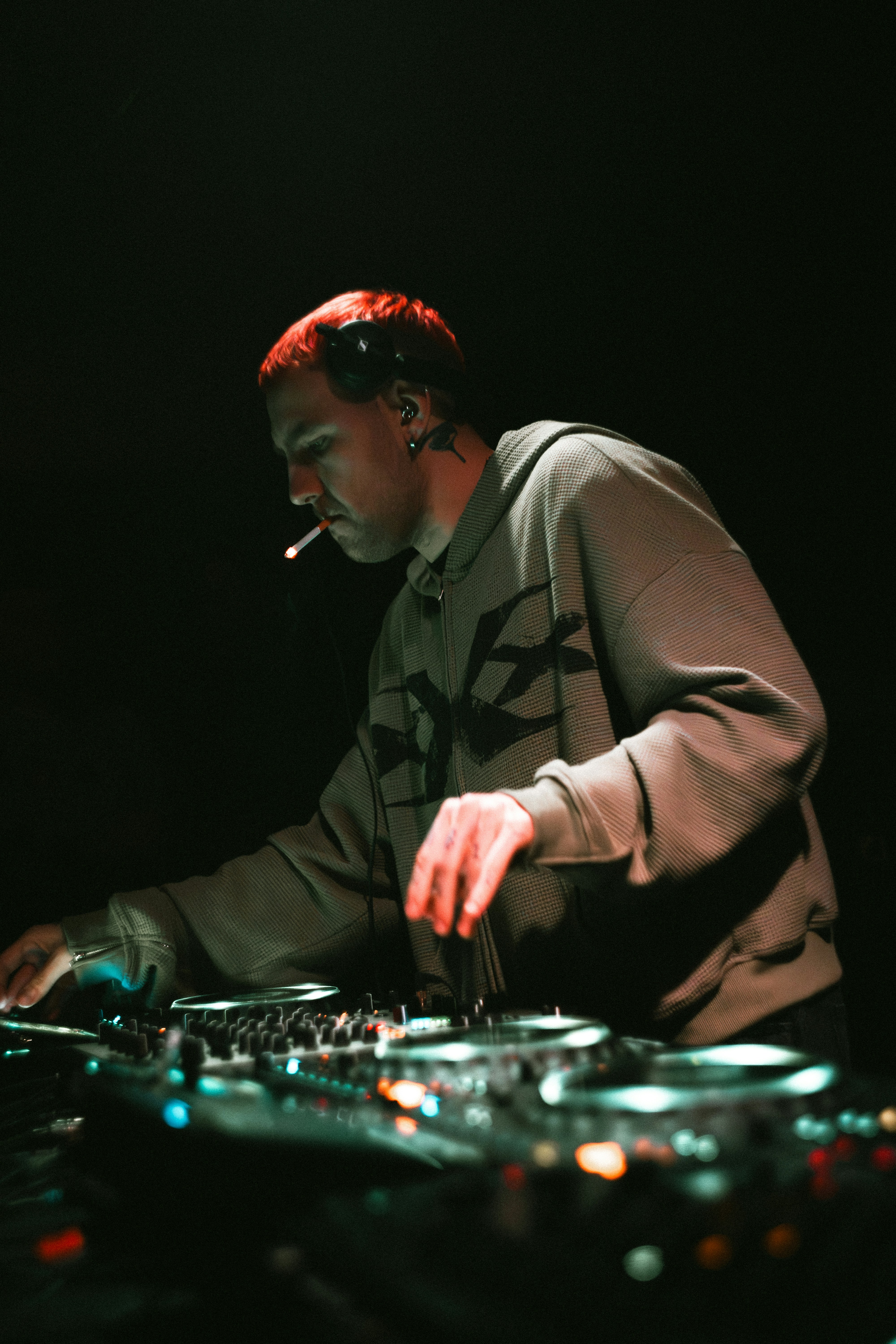 Midnight Mixer: DJ in Shadowed Spotlight