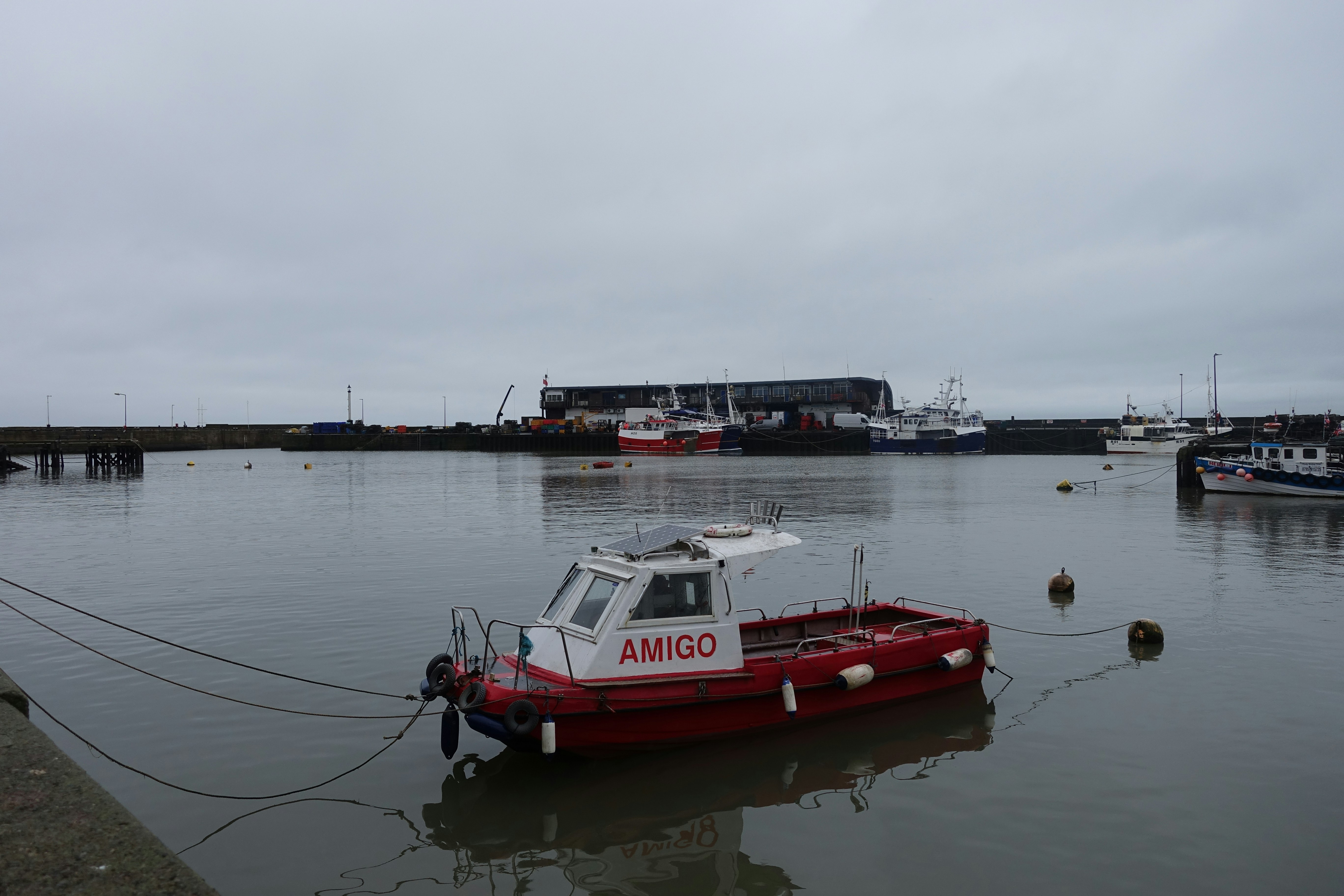Red Rescue Boat AMIGO Anchored at a Quiet Harbor