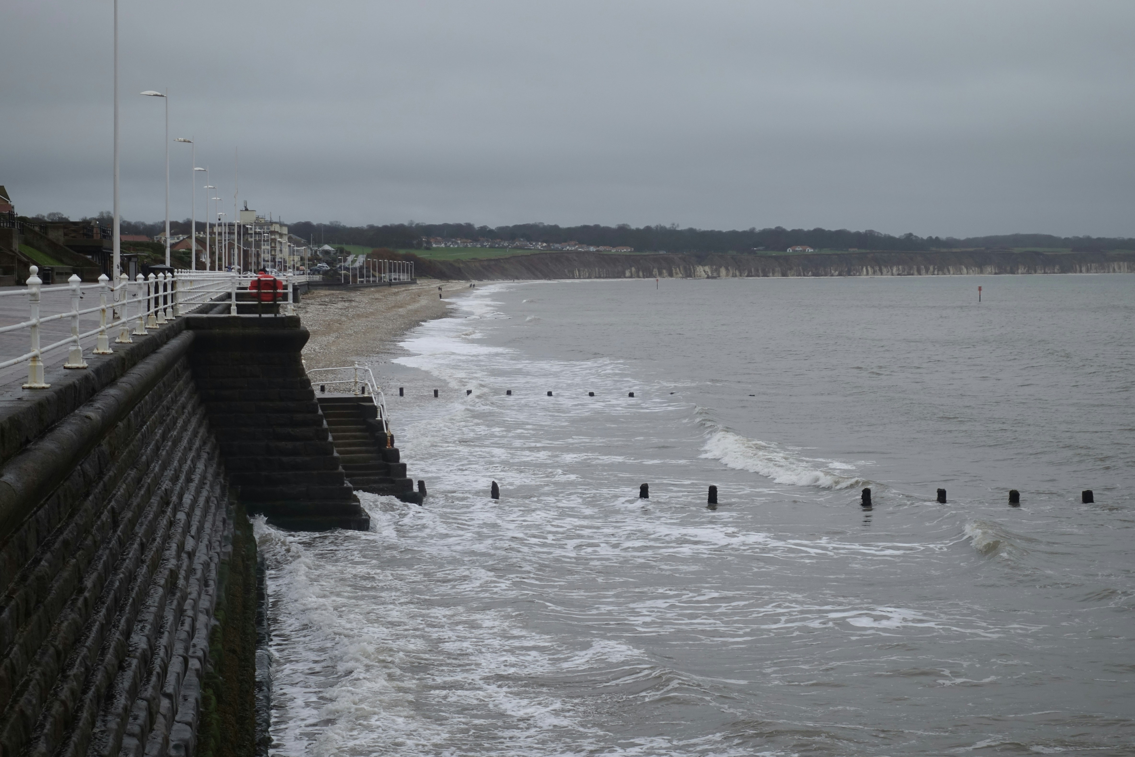 Sea Wall Echoes: A Quiet Coastal Walk by the Pier