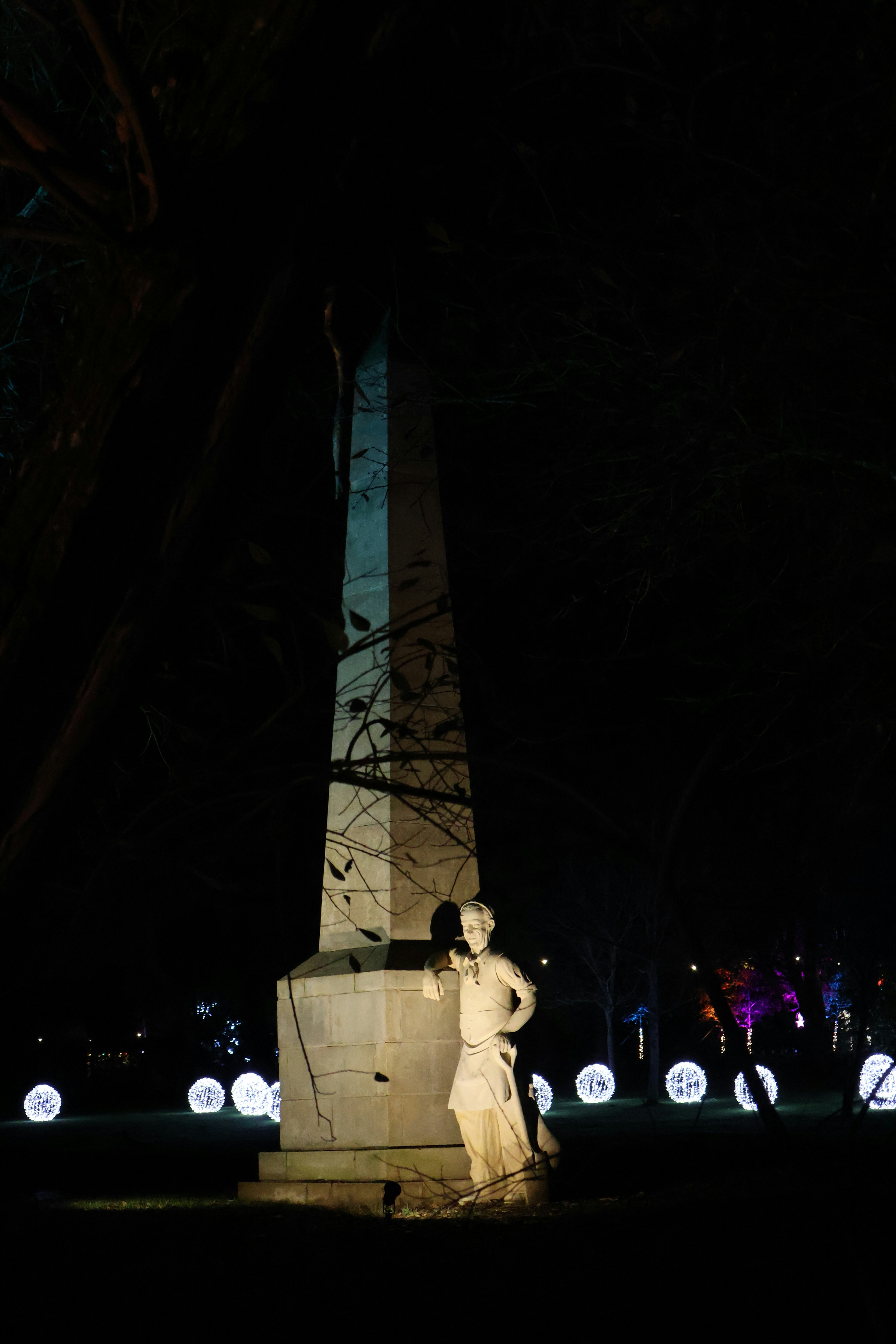 Moonlit Obelisk and Silhouettes: Night Garden by the Sculpture