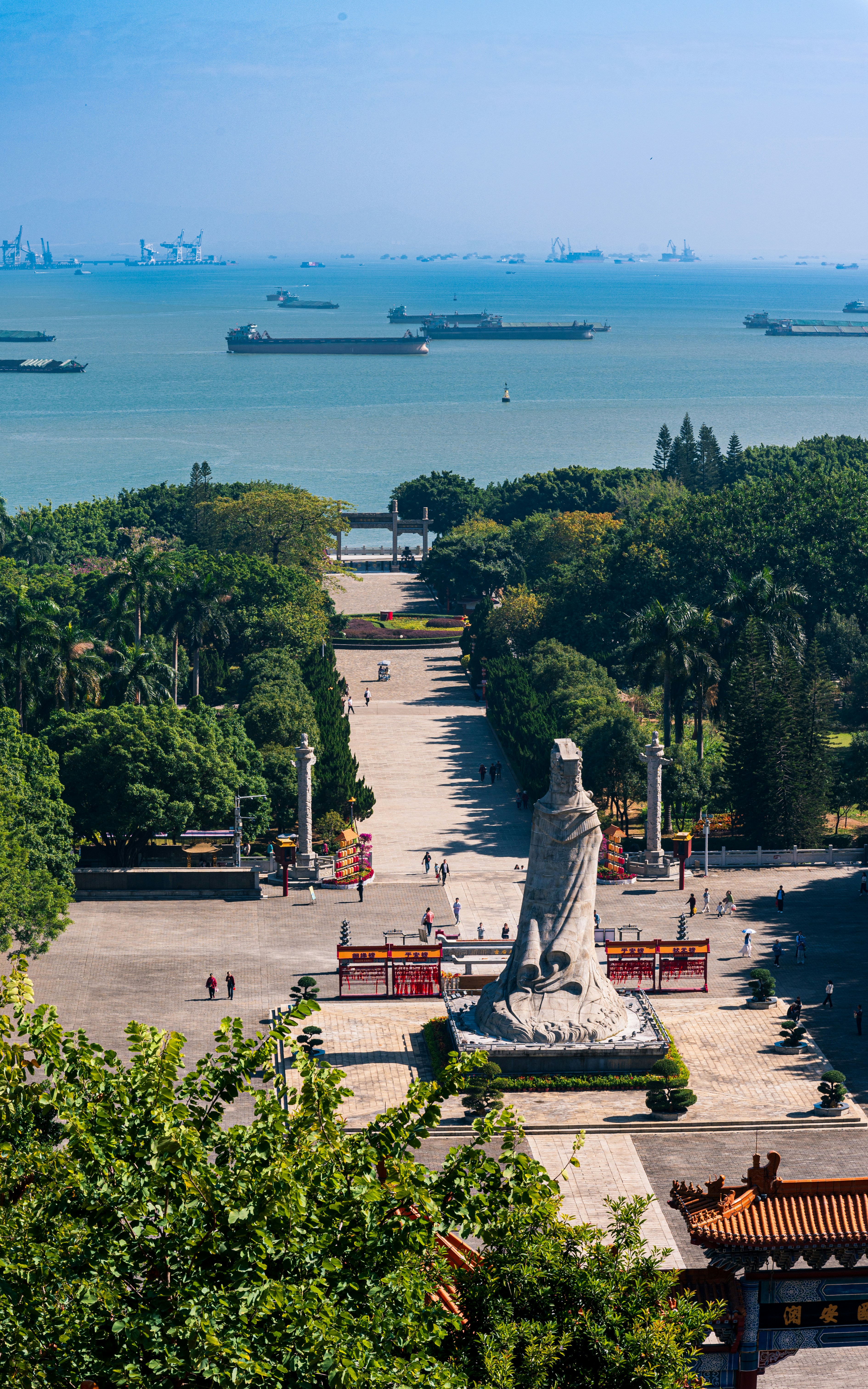 Carved Promenade Toward the Sea: A Monument Framed by Gentle Greenery
